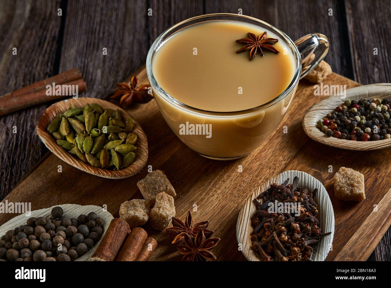 Traditional Indian drink - masala tea with spices. Cinnamon, cardamom ...