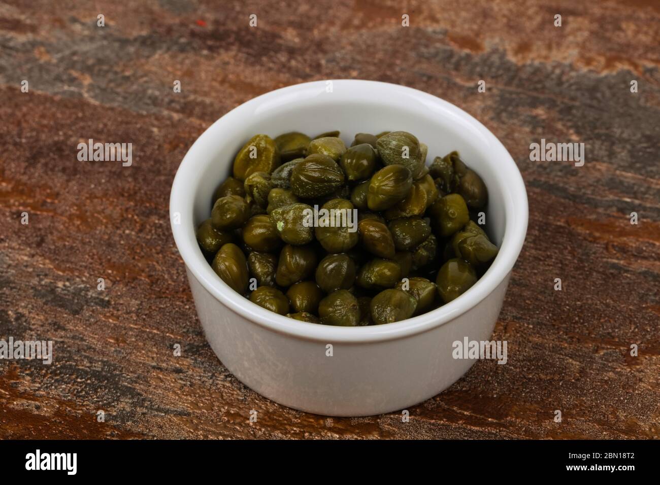 Marinated Capers in the bowl Stock Photo - Alamy