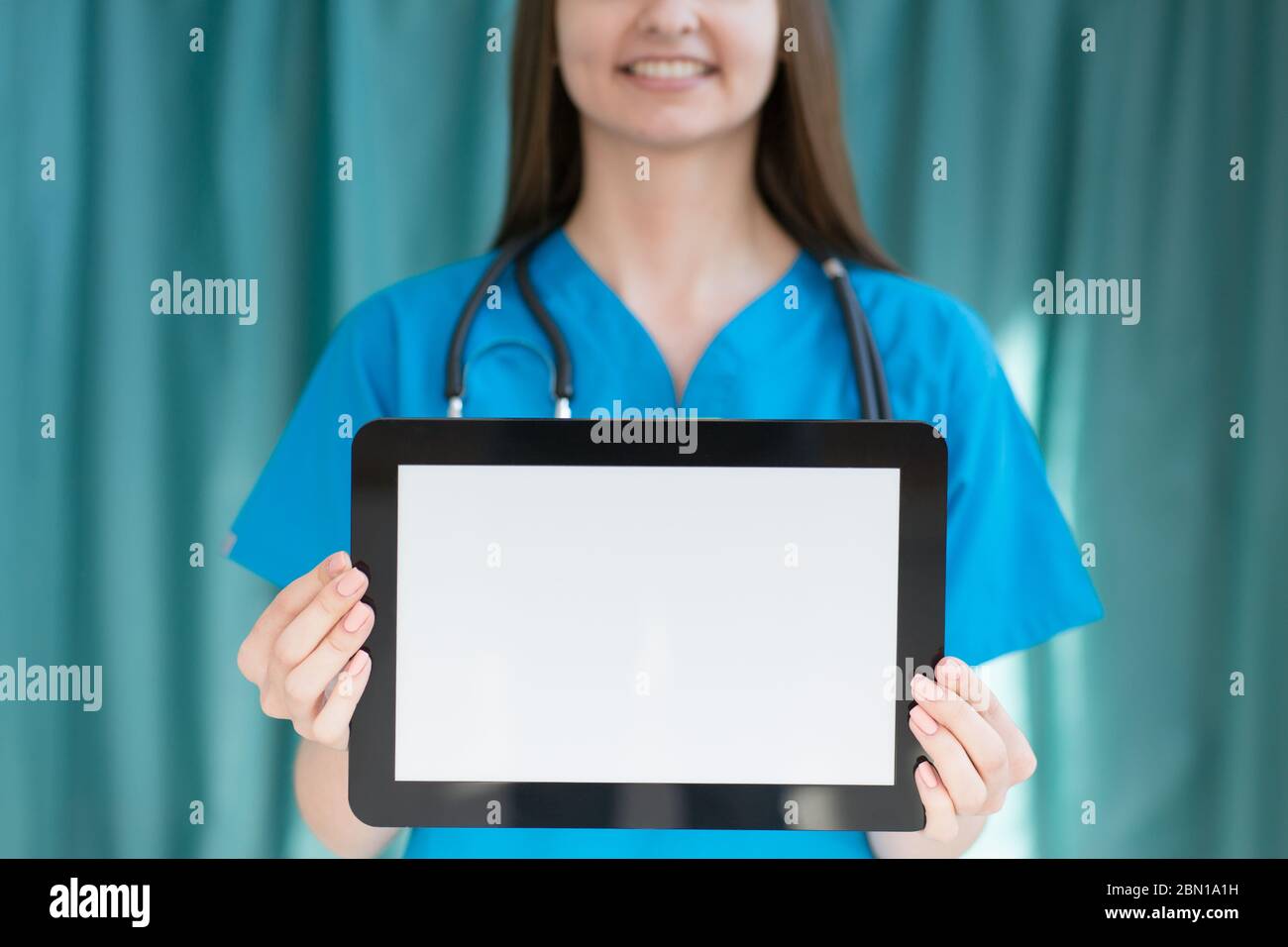 Medical doctor holding tablet in hands, photo with depth of field Stock ...