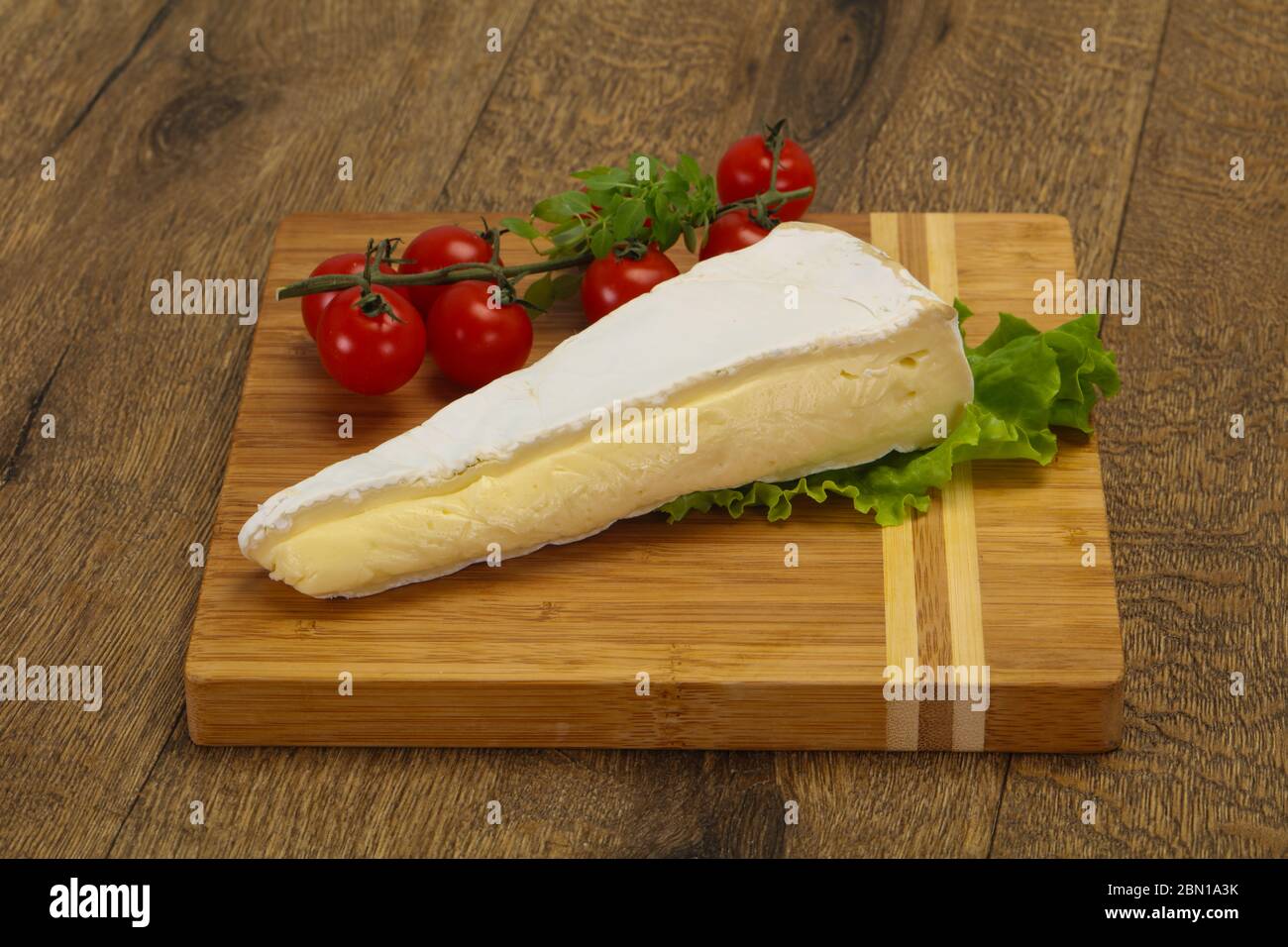 Brie cheese triangle served salad leaves Stock Photo - Alamy