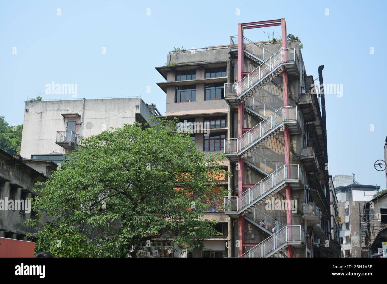 Building behind a concrete wall hi-res stock photography and images - Alamy