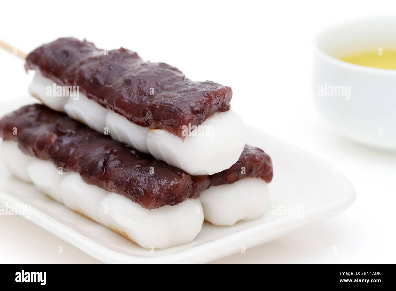Japanese traditional confectionery Kushi Anko Dango on white background ...