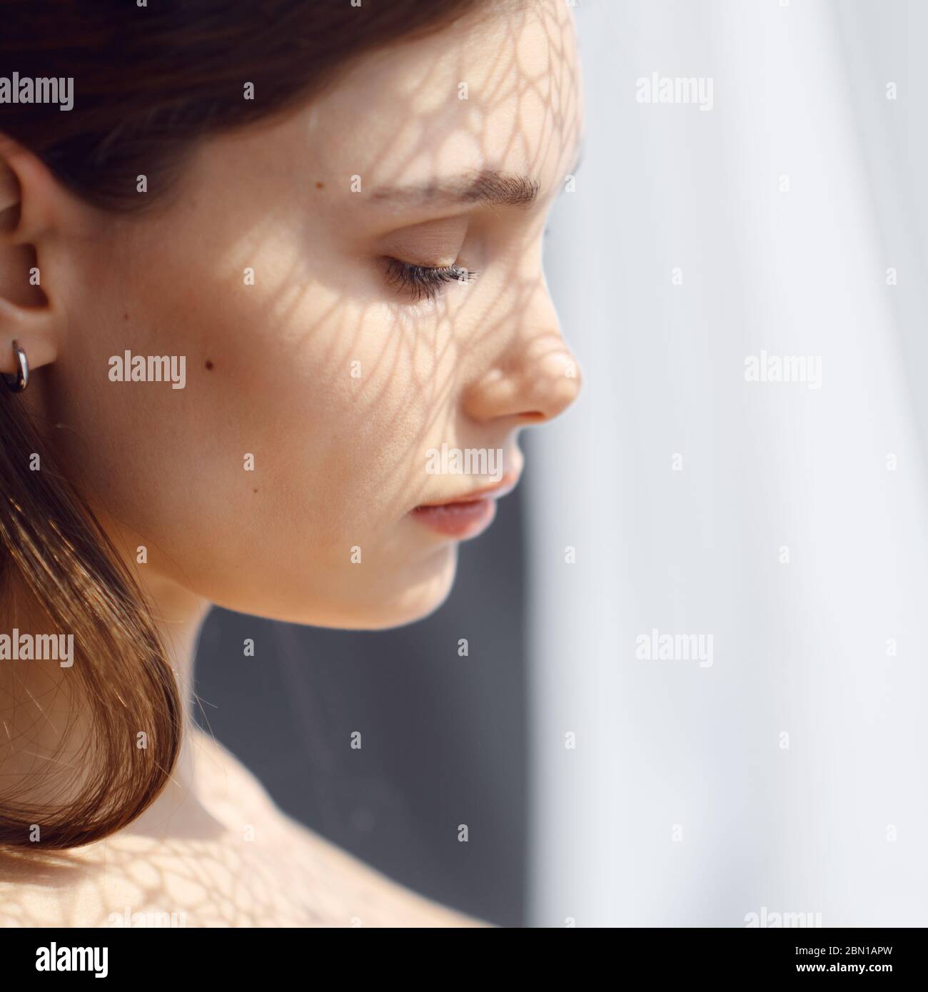 portrait of a girl by the window Stock Photo - Alamy