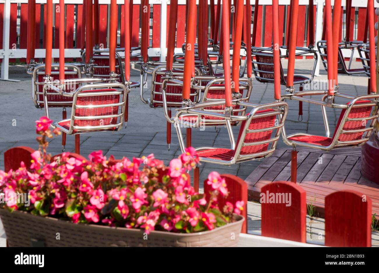 red hanging chairs on a chain carousel (Kazan, Russia Stock Photo - Alamy