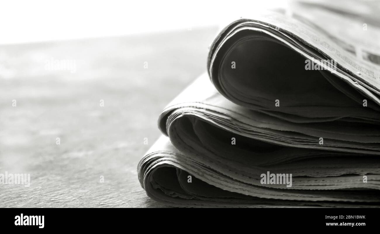Rolled up newspapers hi-res stock photography and images - Alamy