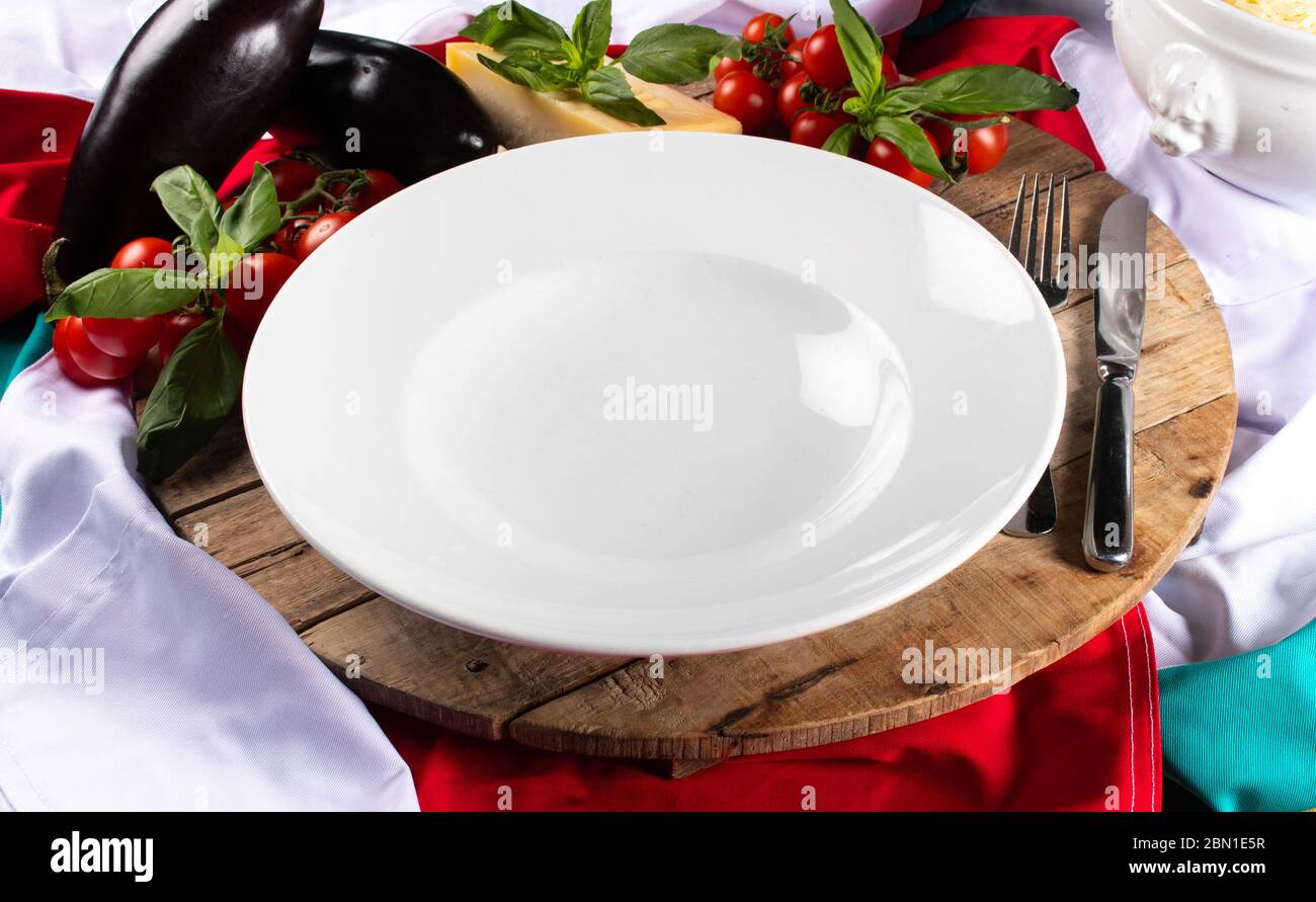 Italian decorated table with Italian flag, vegetables and wooden rustic ...