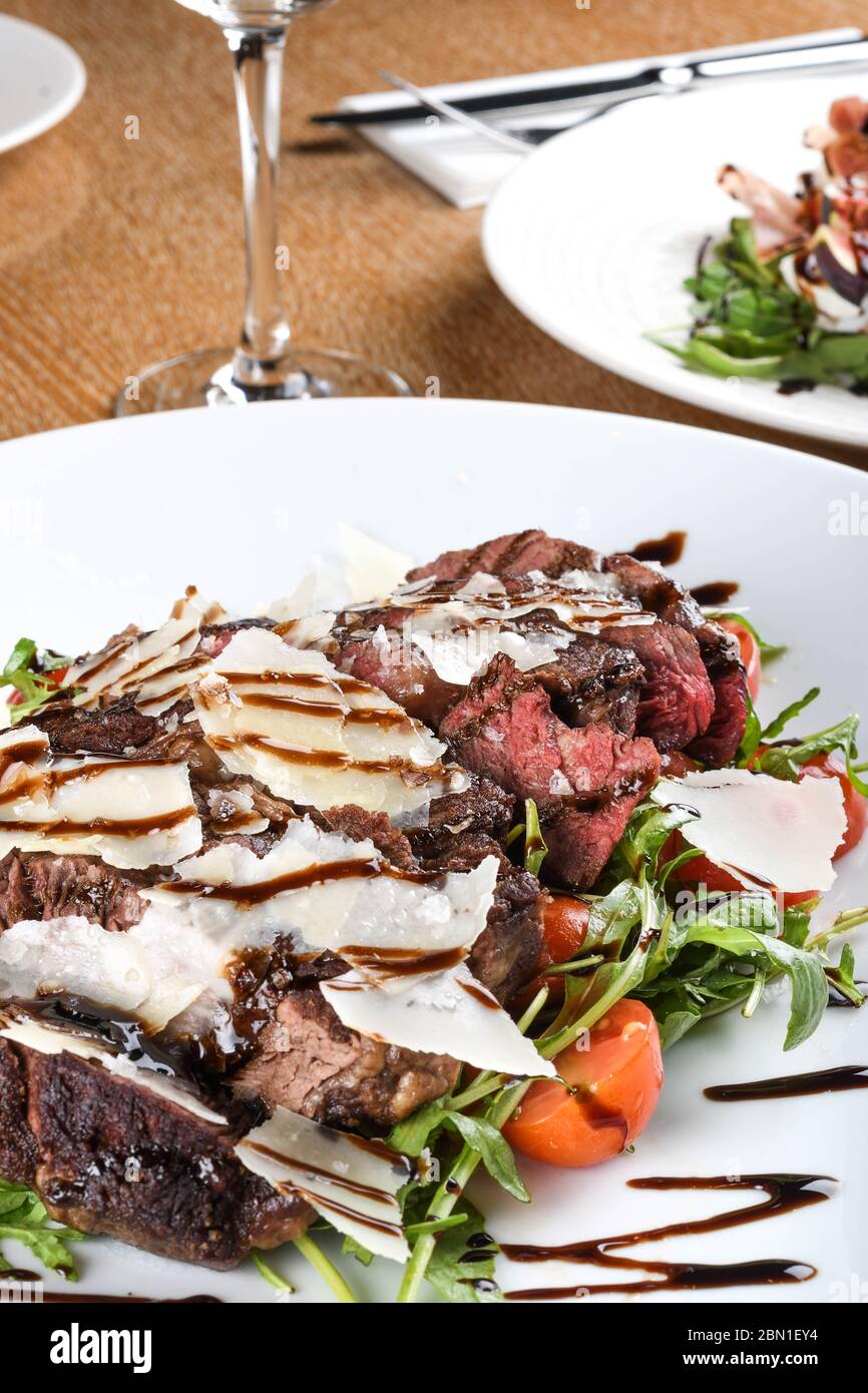 Traditional Italian main dish. Beef tagliata: tender beef rib eye ...