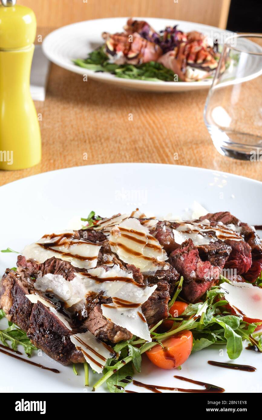 Traditional Italian main dish. Beef tagliata: tender beef rib eye ...
