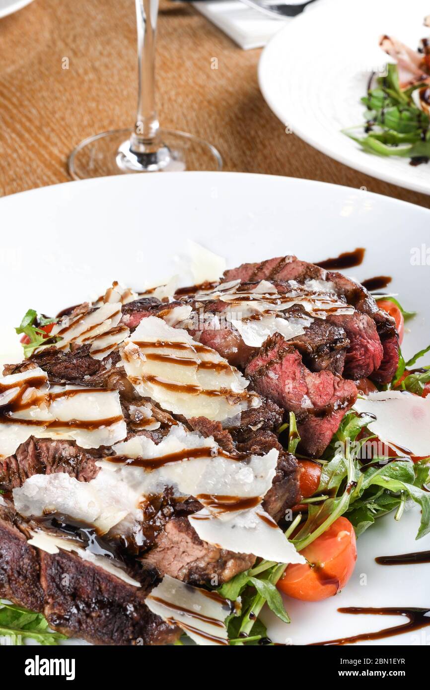 Traditional Italian main dish. Beef tagliata: tender beef rib eye ...