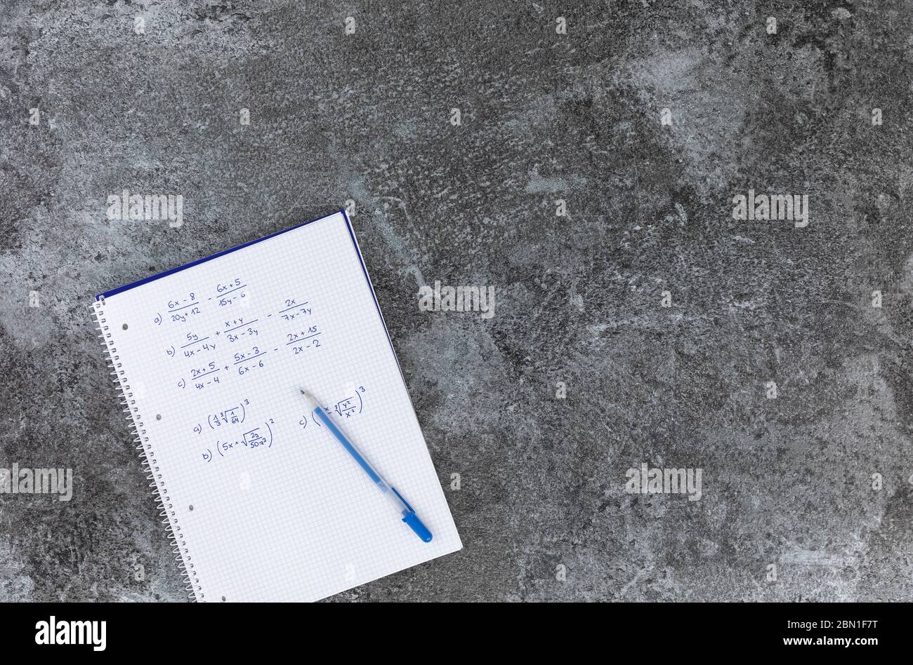 Hand written mathematics book with arithmetic problems, with blue ...