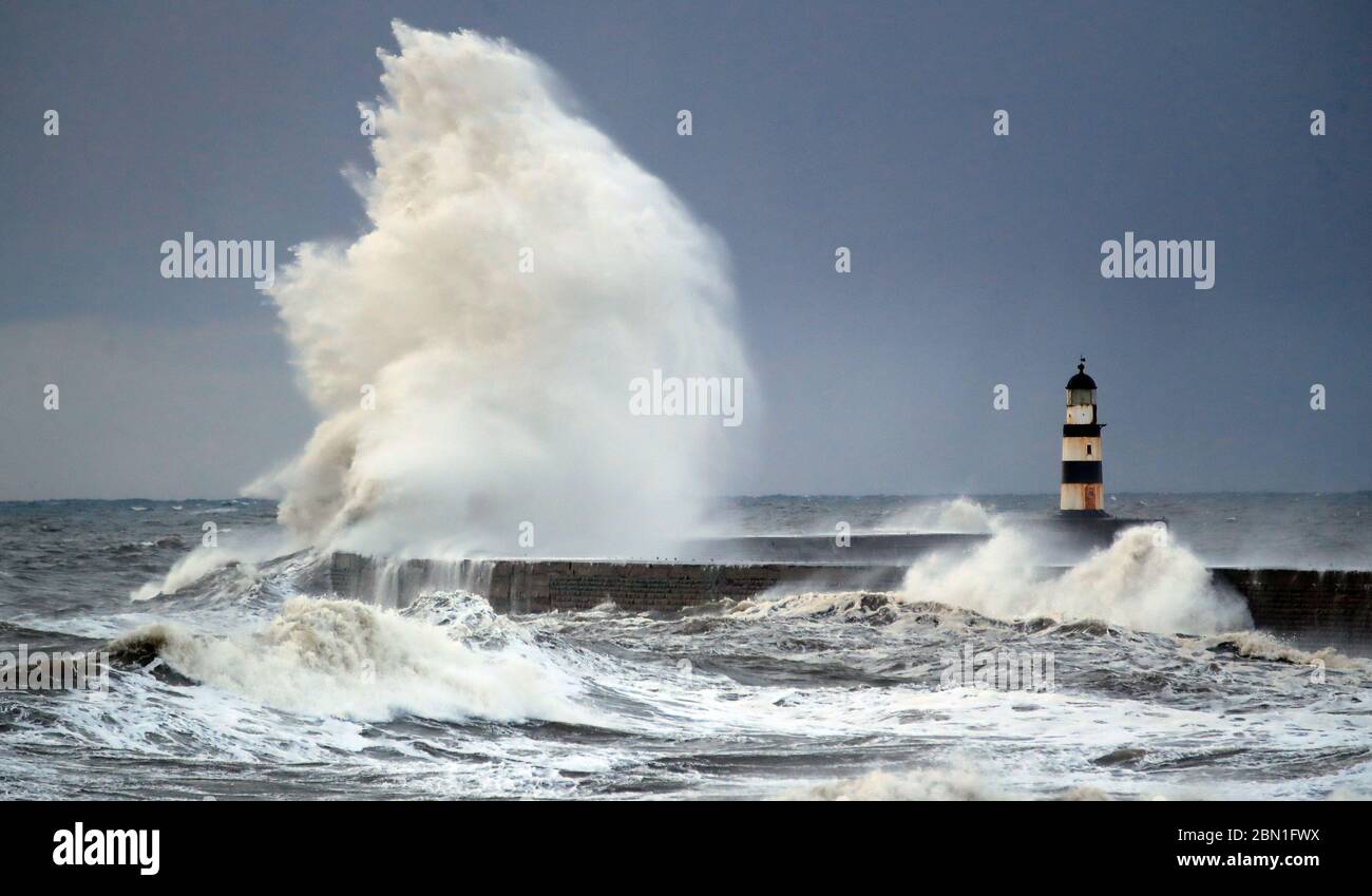 Waves crash over Seaham Lighthouse in Seaham, County Durham Stock Photo ...