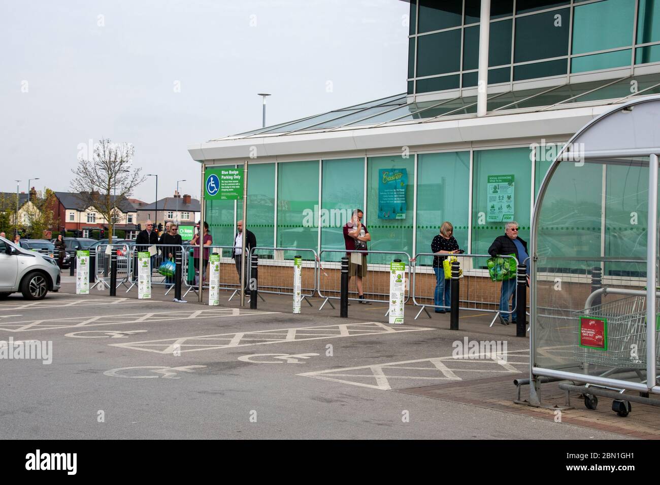 Sheffield UK – April 09 2020: Long socially distanced queue at Asda ...