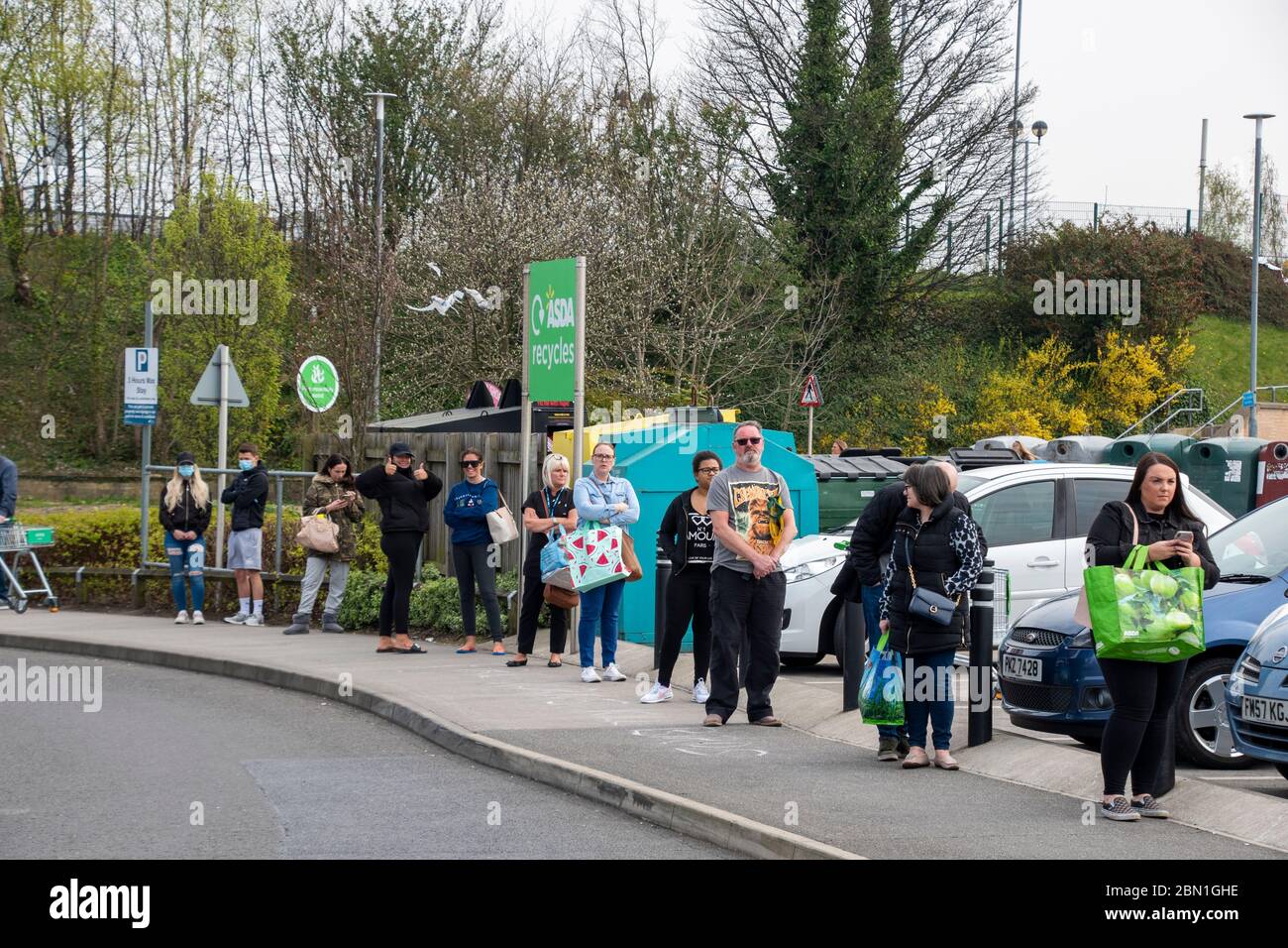 Sheffield UK – April 09 2020: Long socially distanced queue at Asda ...