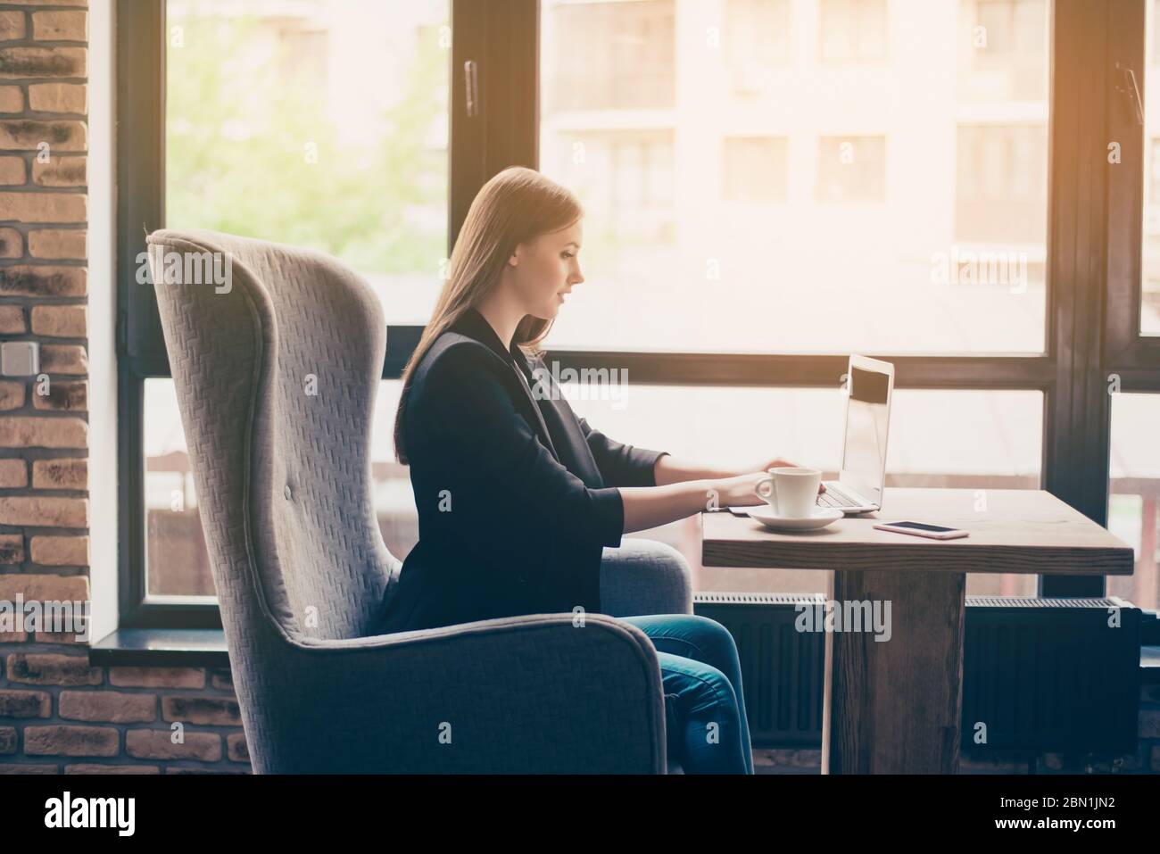 Woman sitting in modern chair profile hi-res stock photography and ...