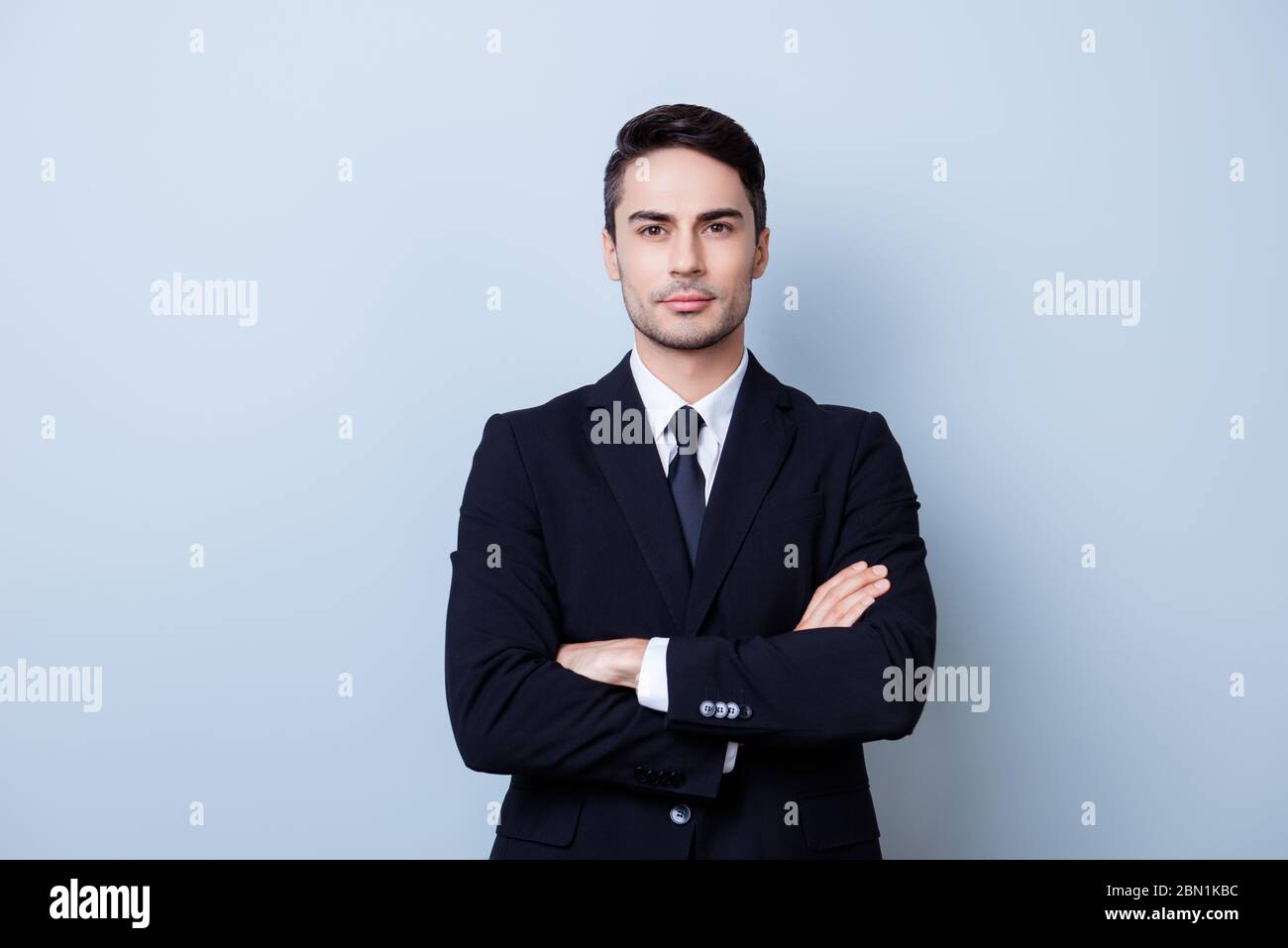 Successful young handsome brunete hispanic man lawyer in a suit on pure ...