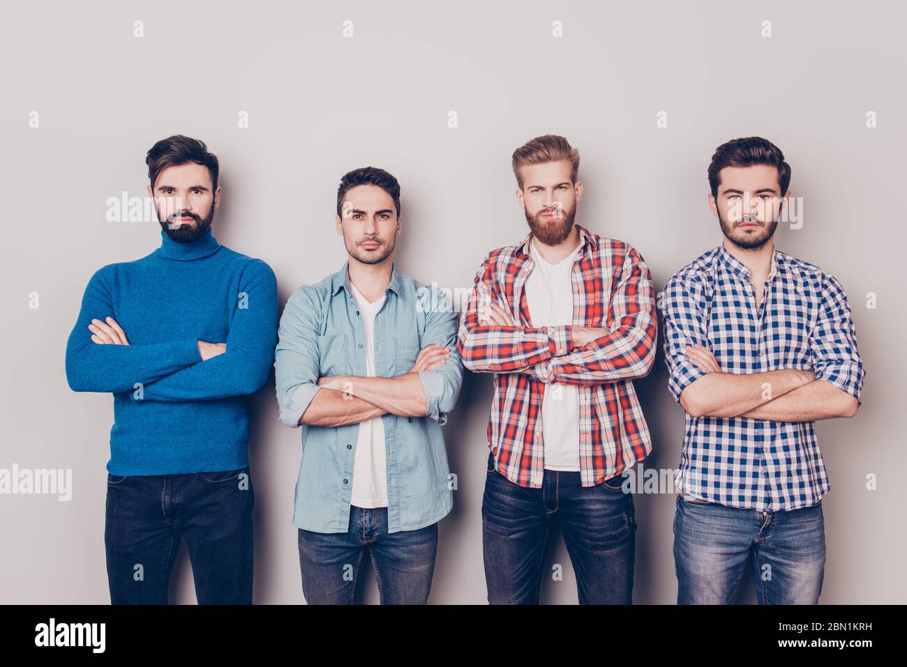 Ethnicity, multicultural diversity. Four serious harsh men are standing ...