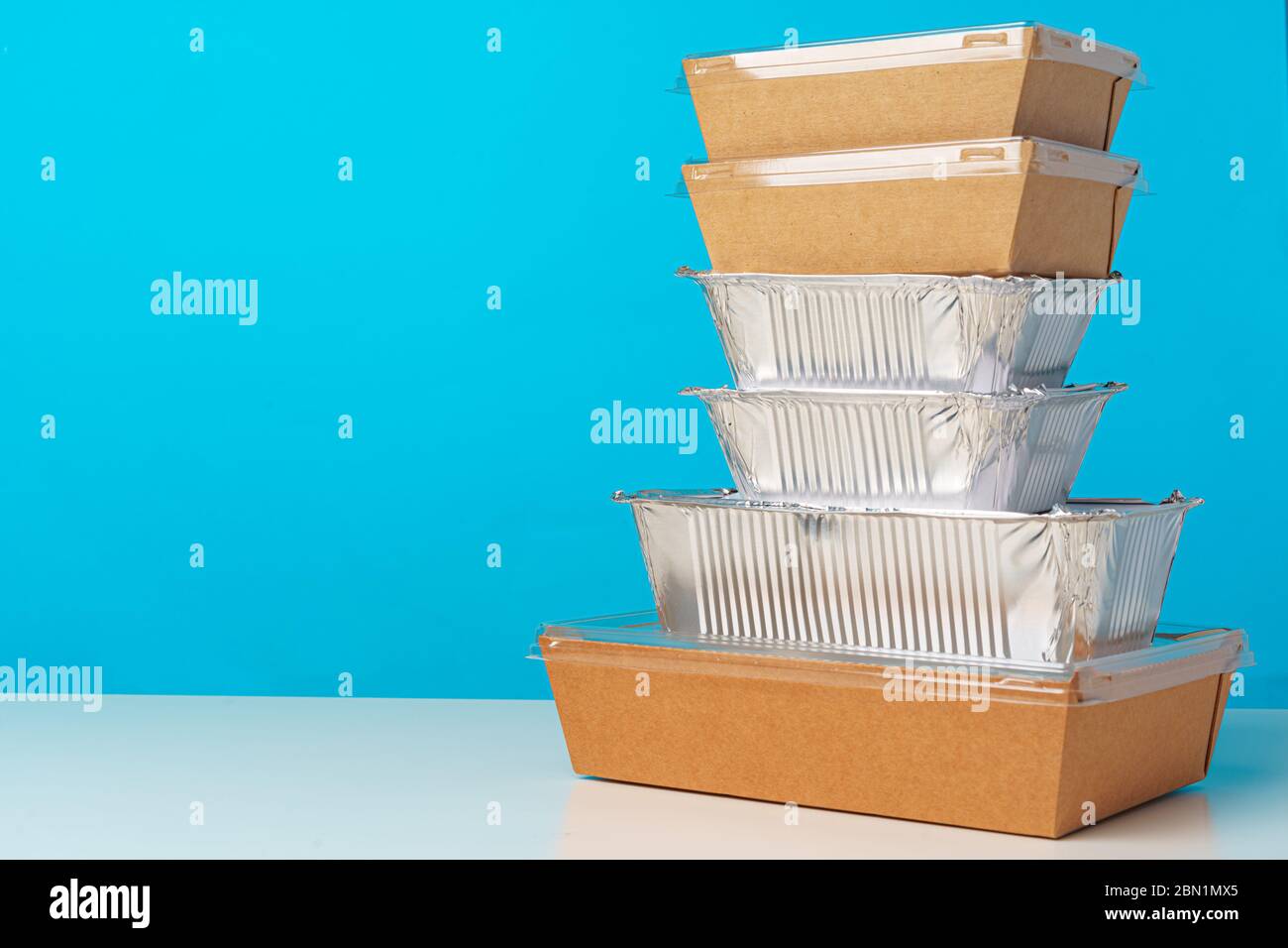 Assortment of various food delivery containers on table Stock Photo - Alamy