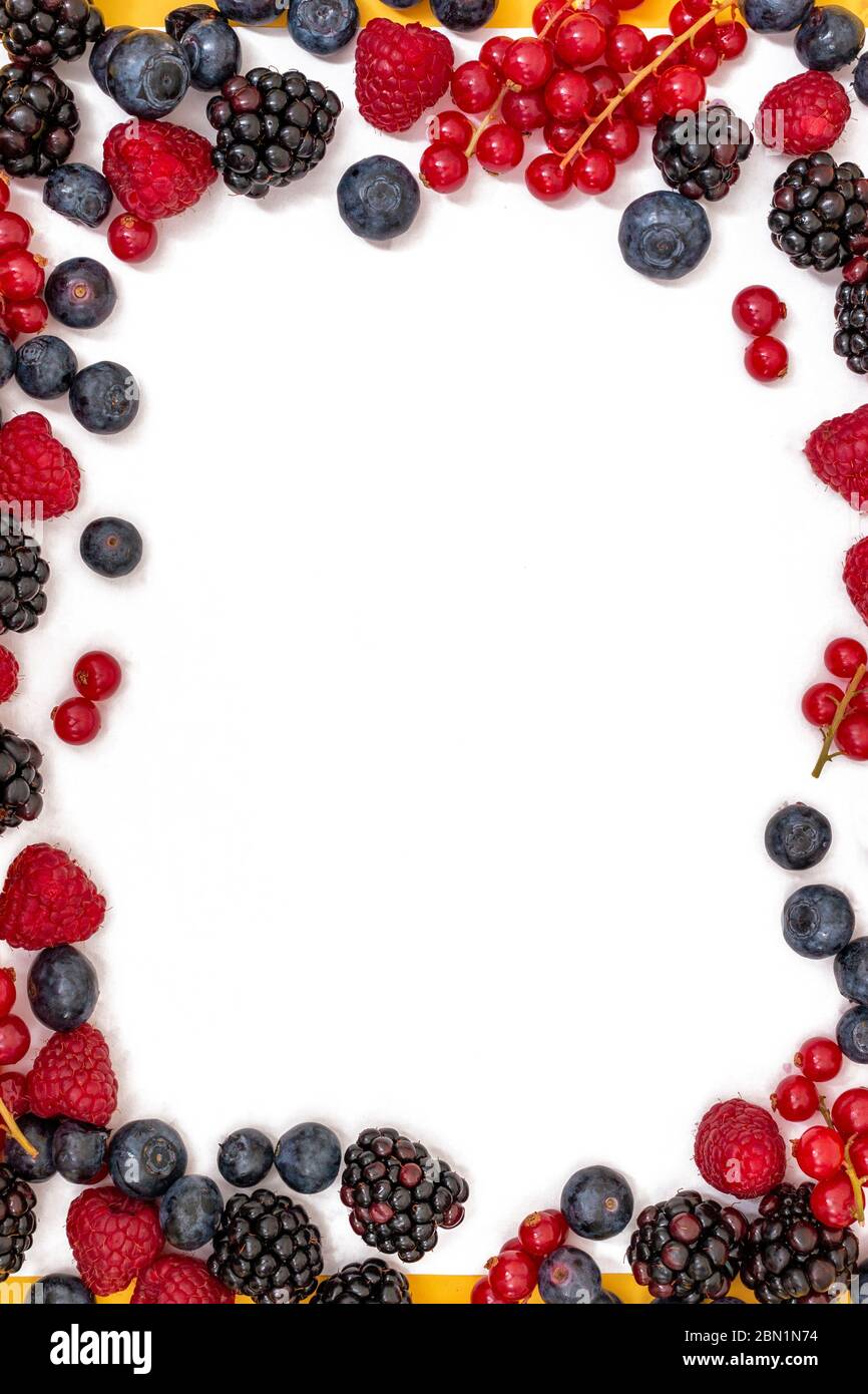 Close view of some fresh mix of fruit berries forming a rectangle ...