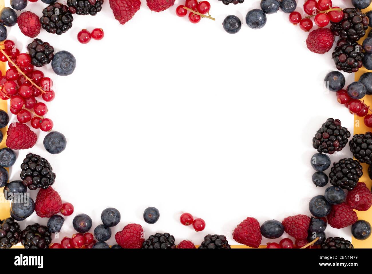 Close view of some fresh mix of fruit berries forming a rectangle ...