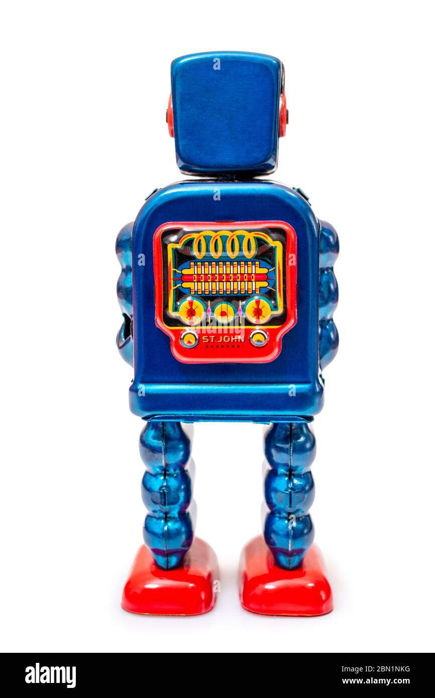 Vintage tin robot toy isolated on a white background Stock Photo - Alamy