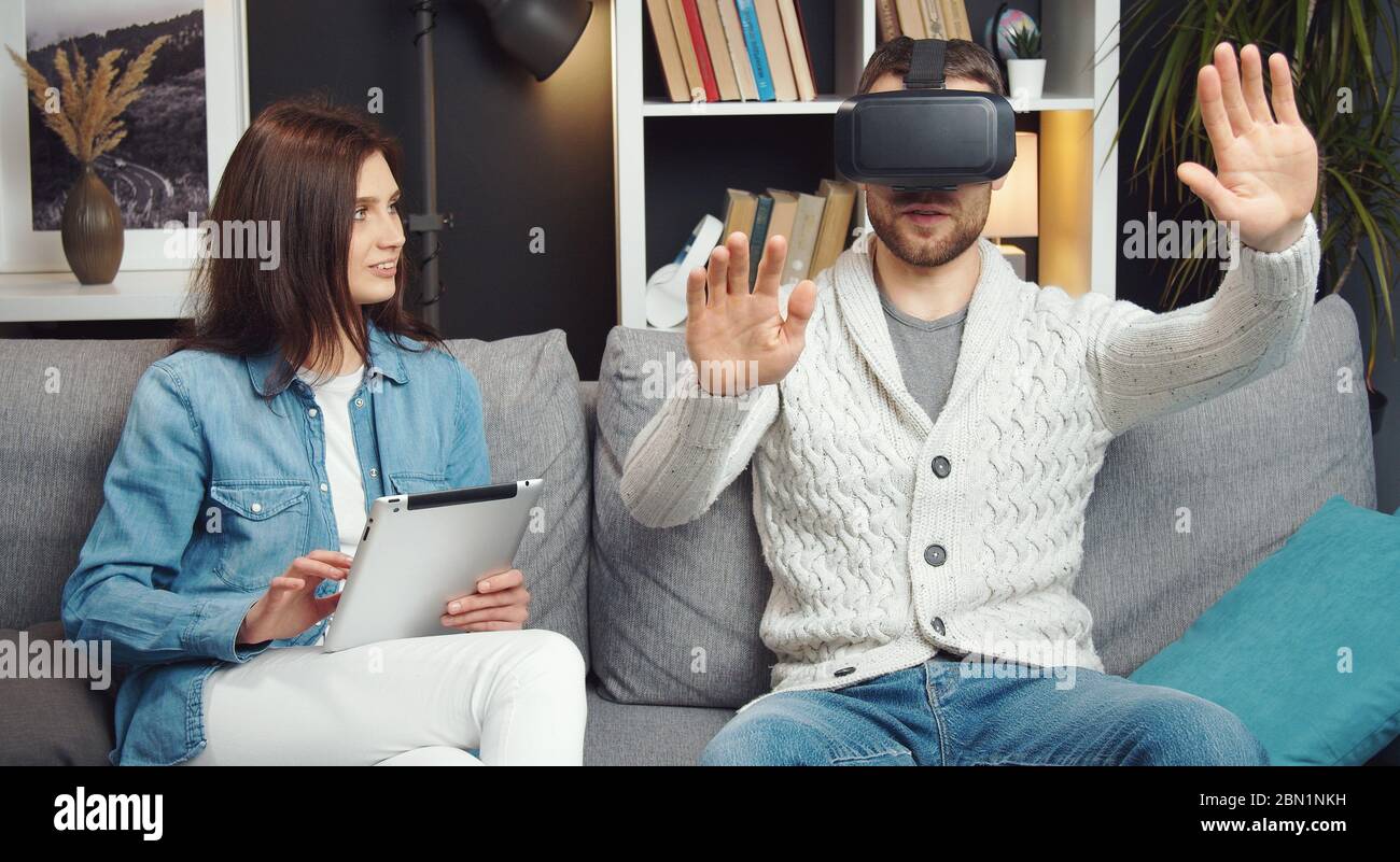 Using vr headset on couch hi-res stock photography and images - Alamy