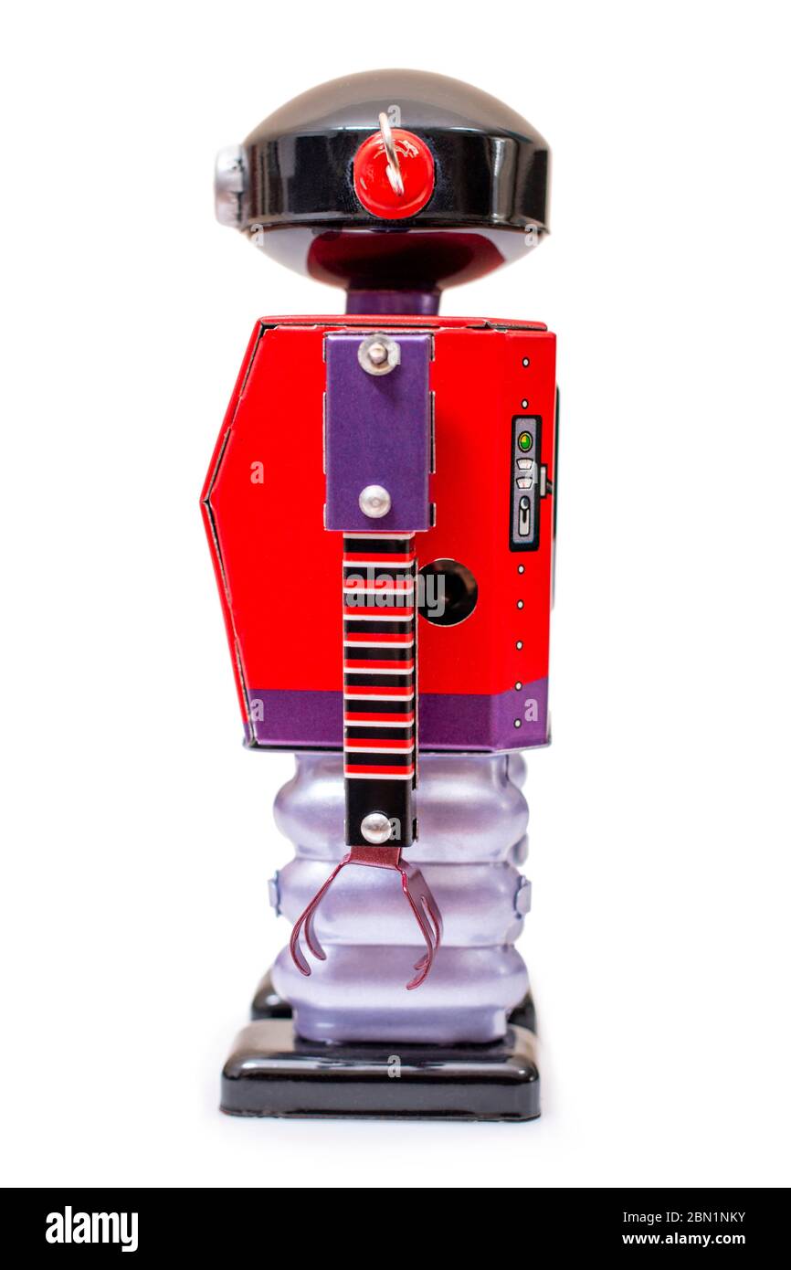 Vintage tin robot toy isolated on a white background Stock Photo - Alamy