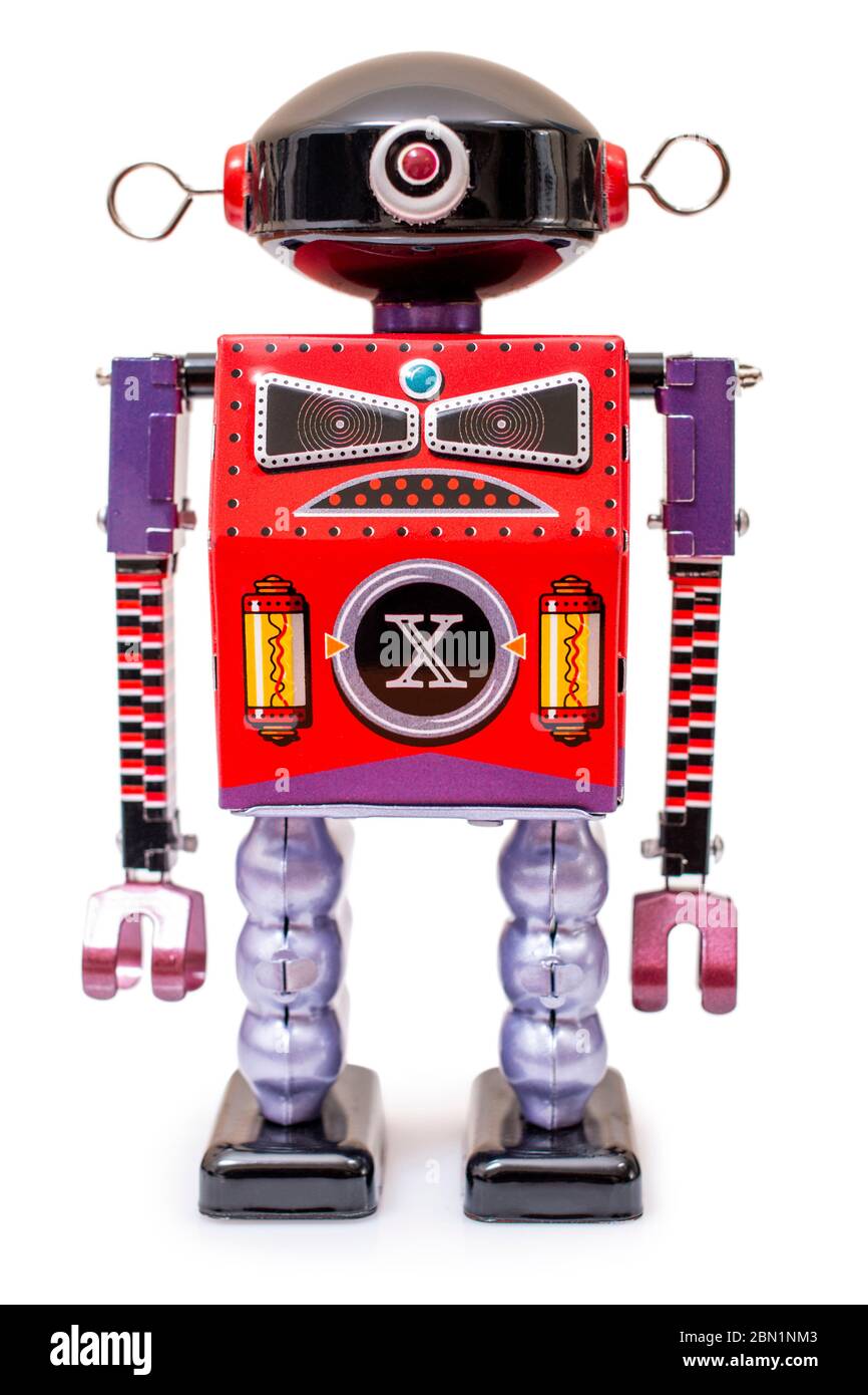 Vintage tin robot toy isolated on a white background Stock Photo - Alamy