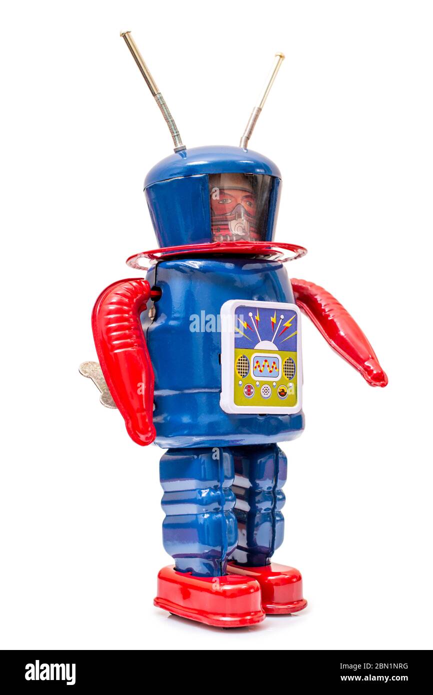 Vintage tin robot toy isolated on a white background Stock Photo - Alamy