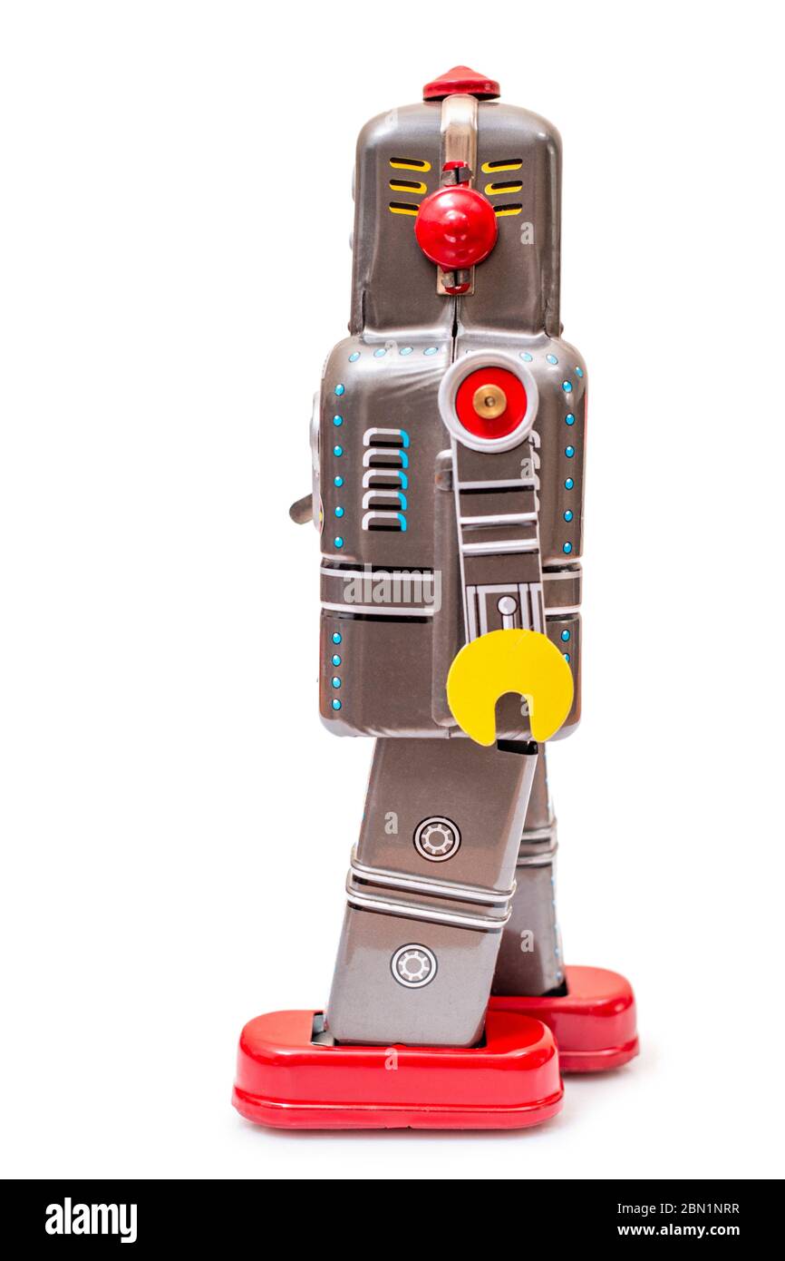 Vintage tin robot toy isolated on a white background Stock Photo - Alamy