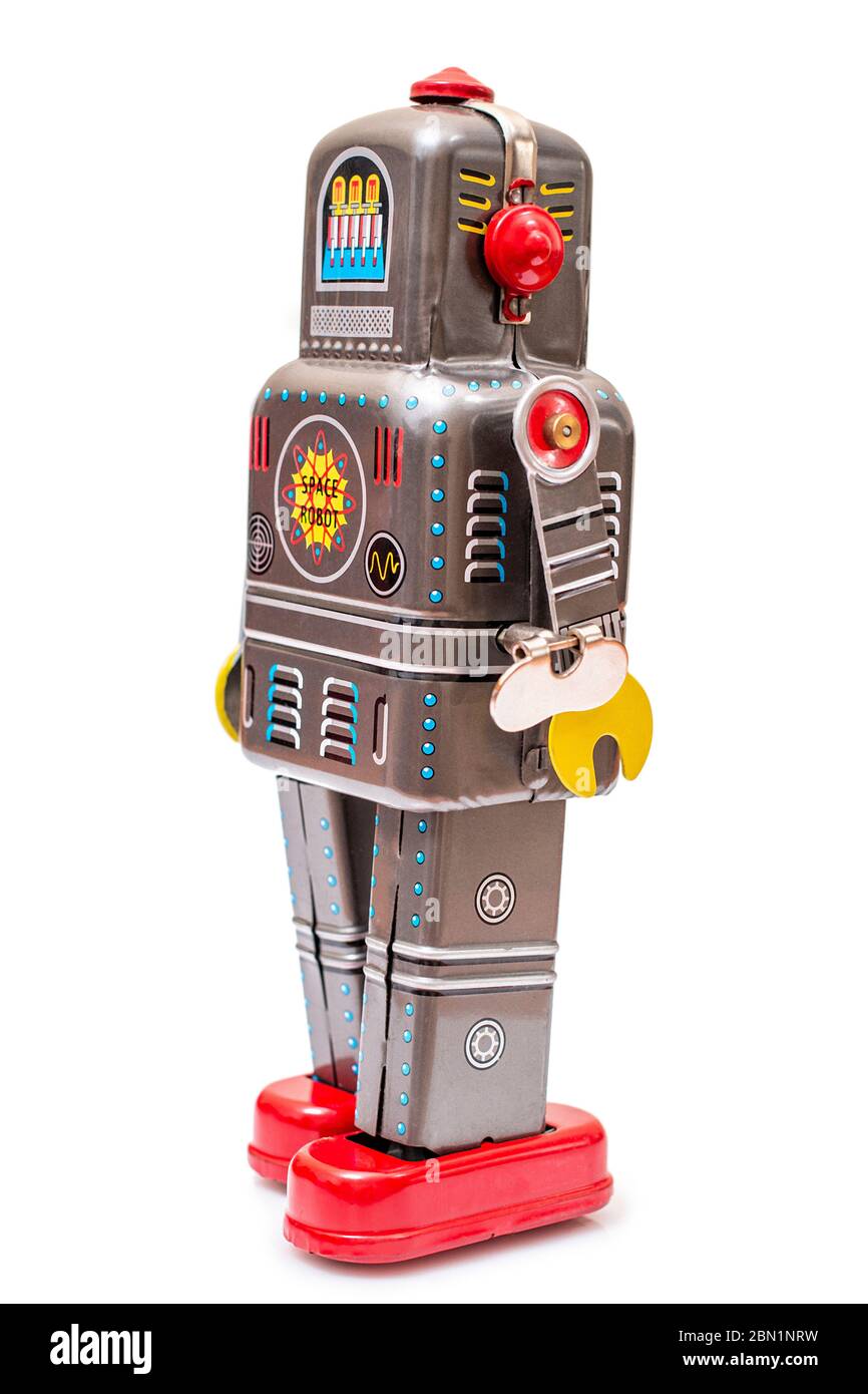 Vintage tin robot toy isolated on a white background Stock Photo - Alamy