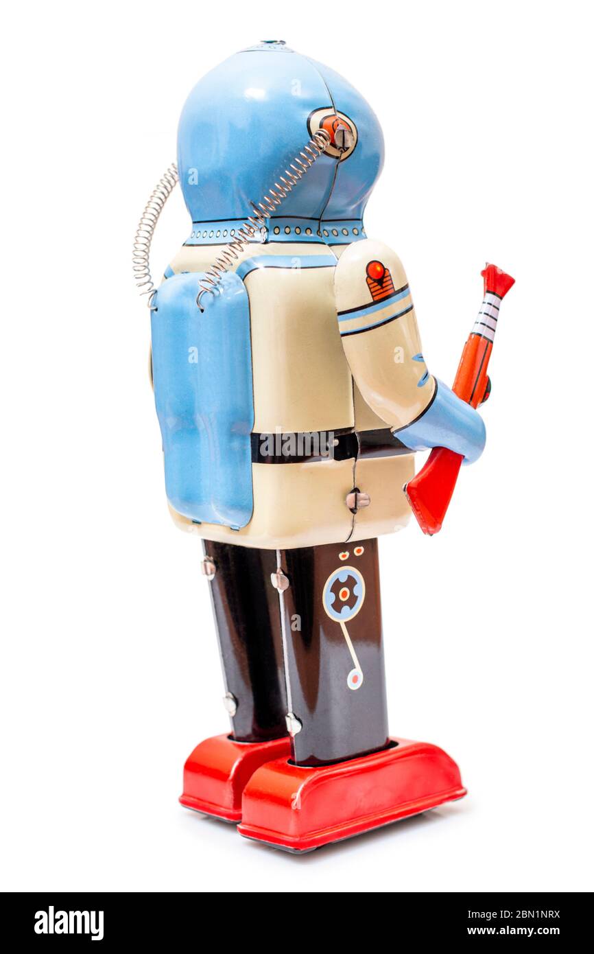 Vintage tin robot toy isolated on a white background Stock Photo - Alamy