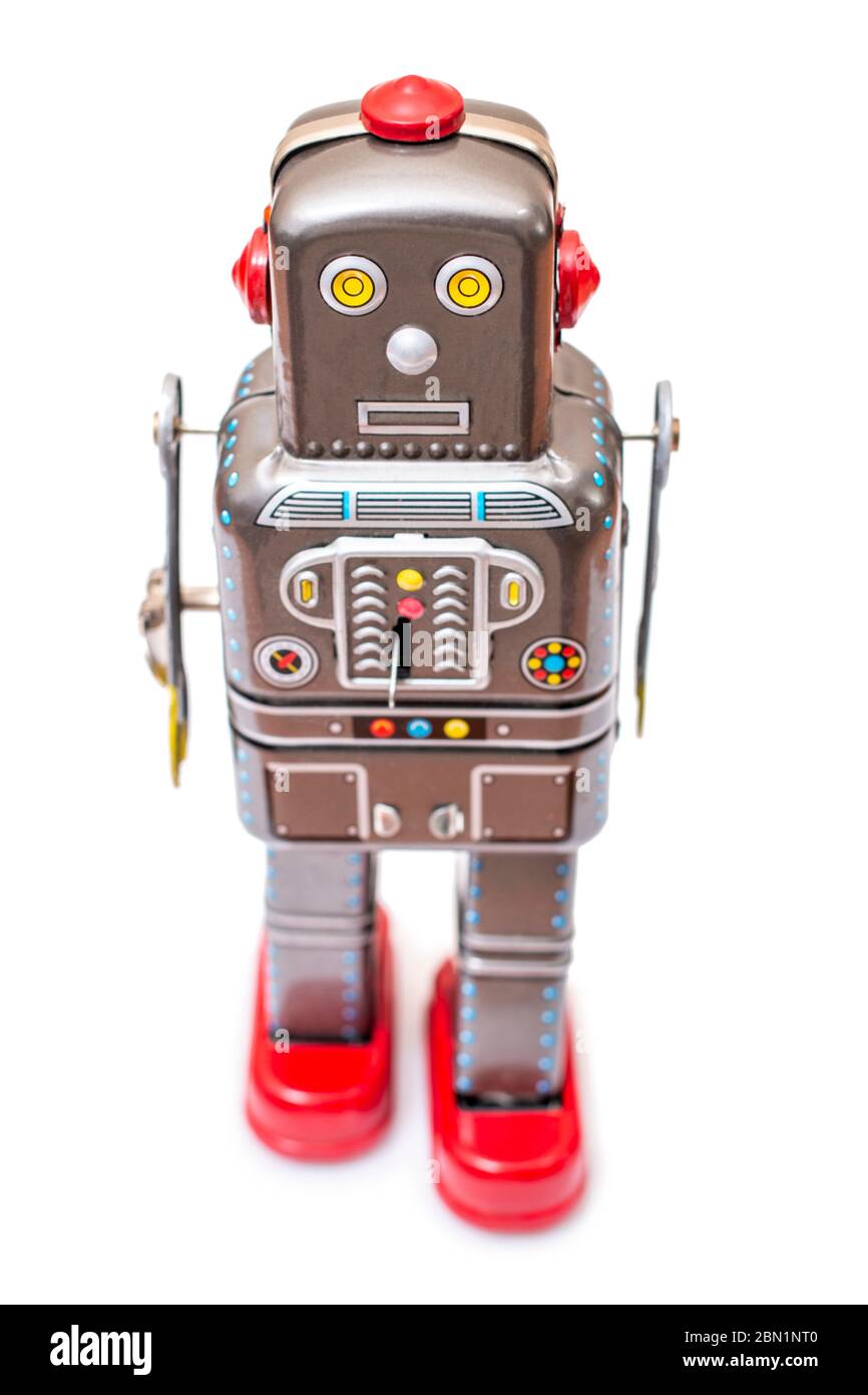 Vintage tin robot toy isolated on a white background Stock Photo - Alamy