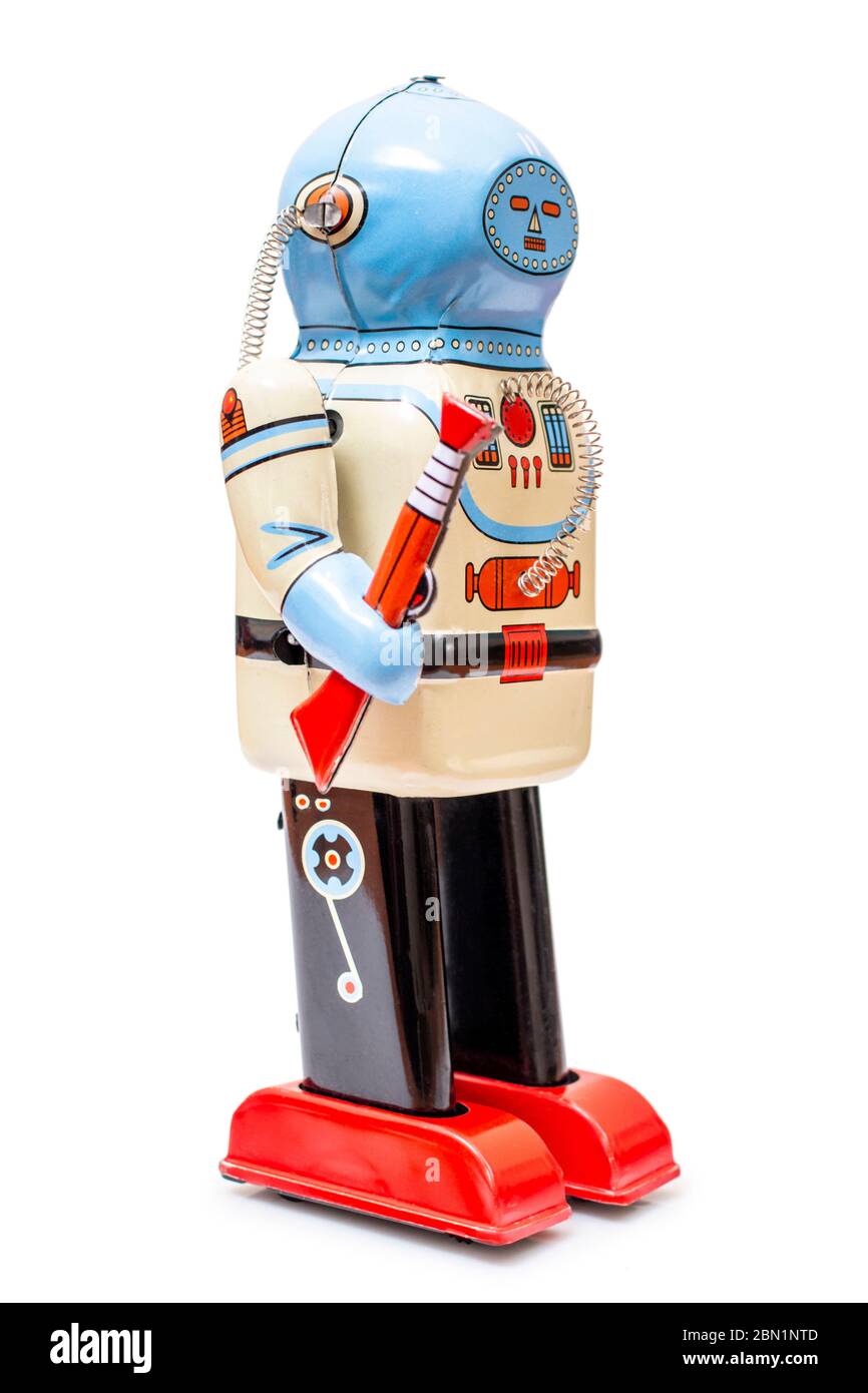 Vintage tin robot toy isolated on a white background Stock Photo - Alamy
