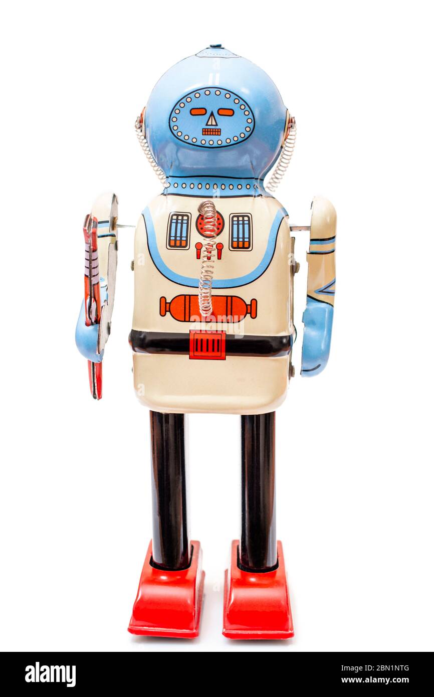 Vintage tin robot toy isolated on a white background Stock Photo - Alamy