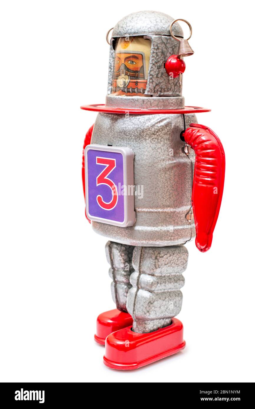 Vintage tin robot toy isolated on a white background Stock Photo - Alamy
