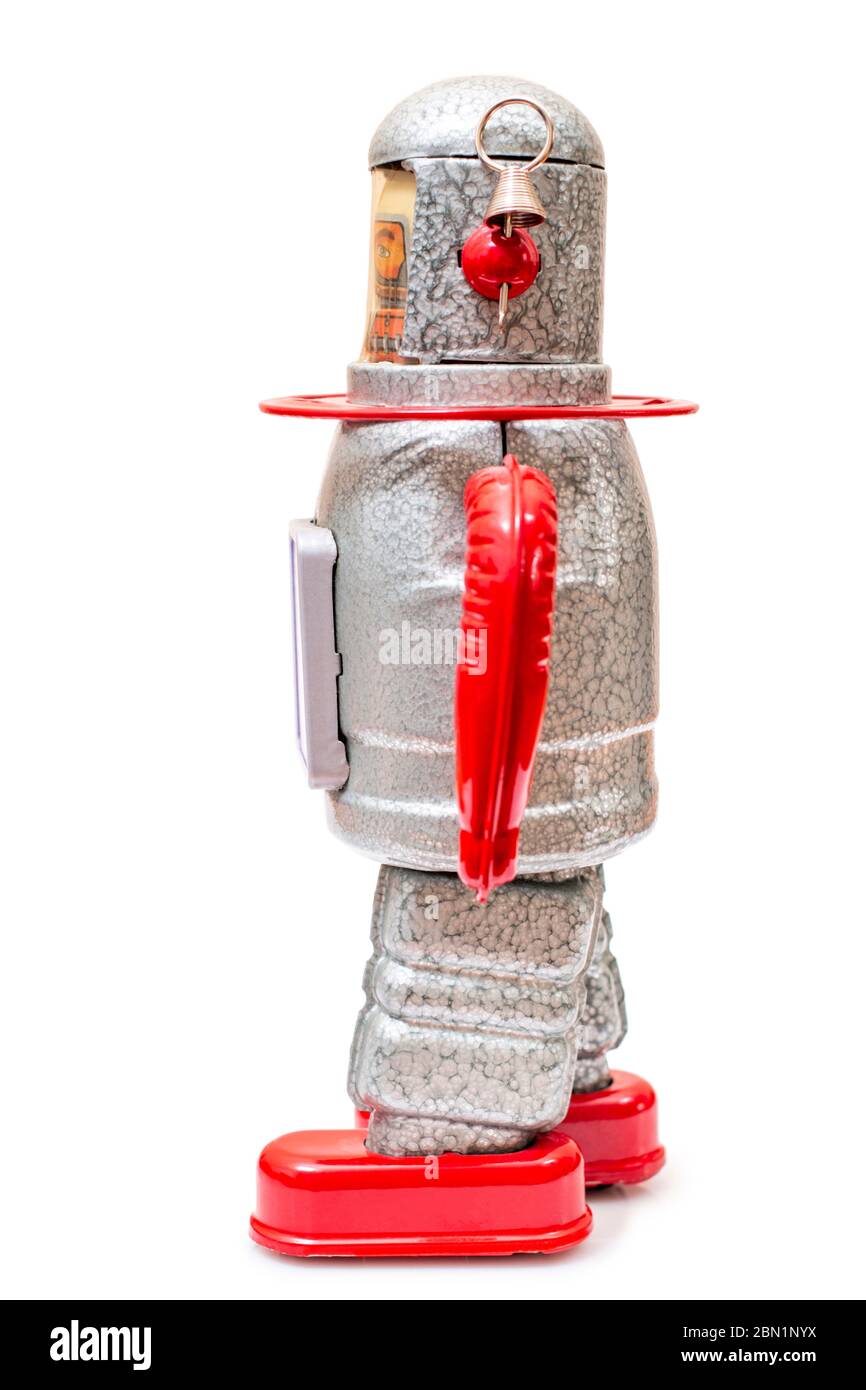 Vintage tin robot toy isolated on a white background Stock Photo - Alamy