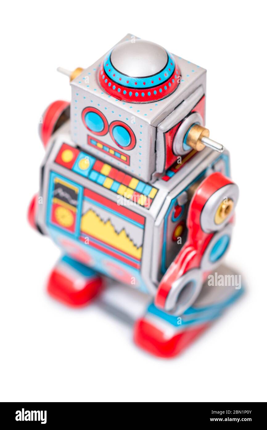 Vintage tin robot toy isolated on a white background Stock Photo - Alamy