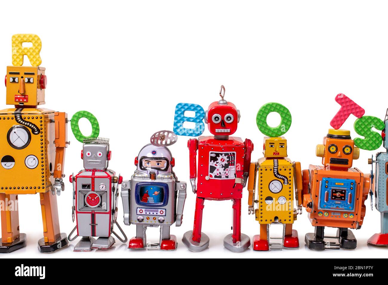 Close up view of colorful mixed vintage tin robot toys collection with ...