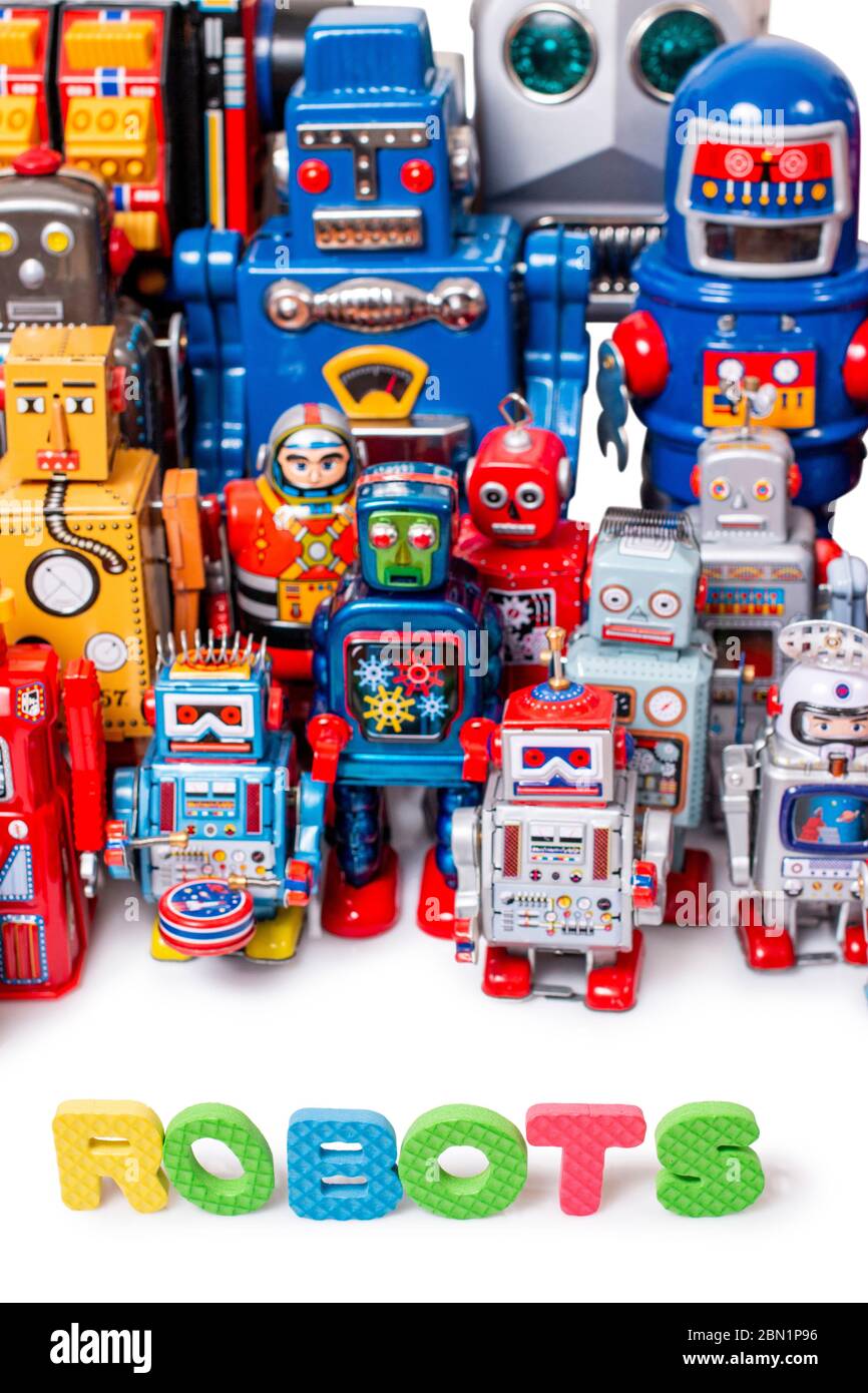 Close up view of colorful mixed vintage tin robot toys collection with ...