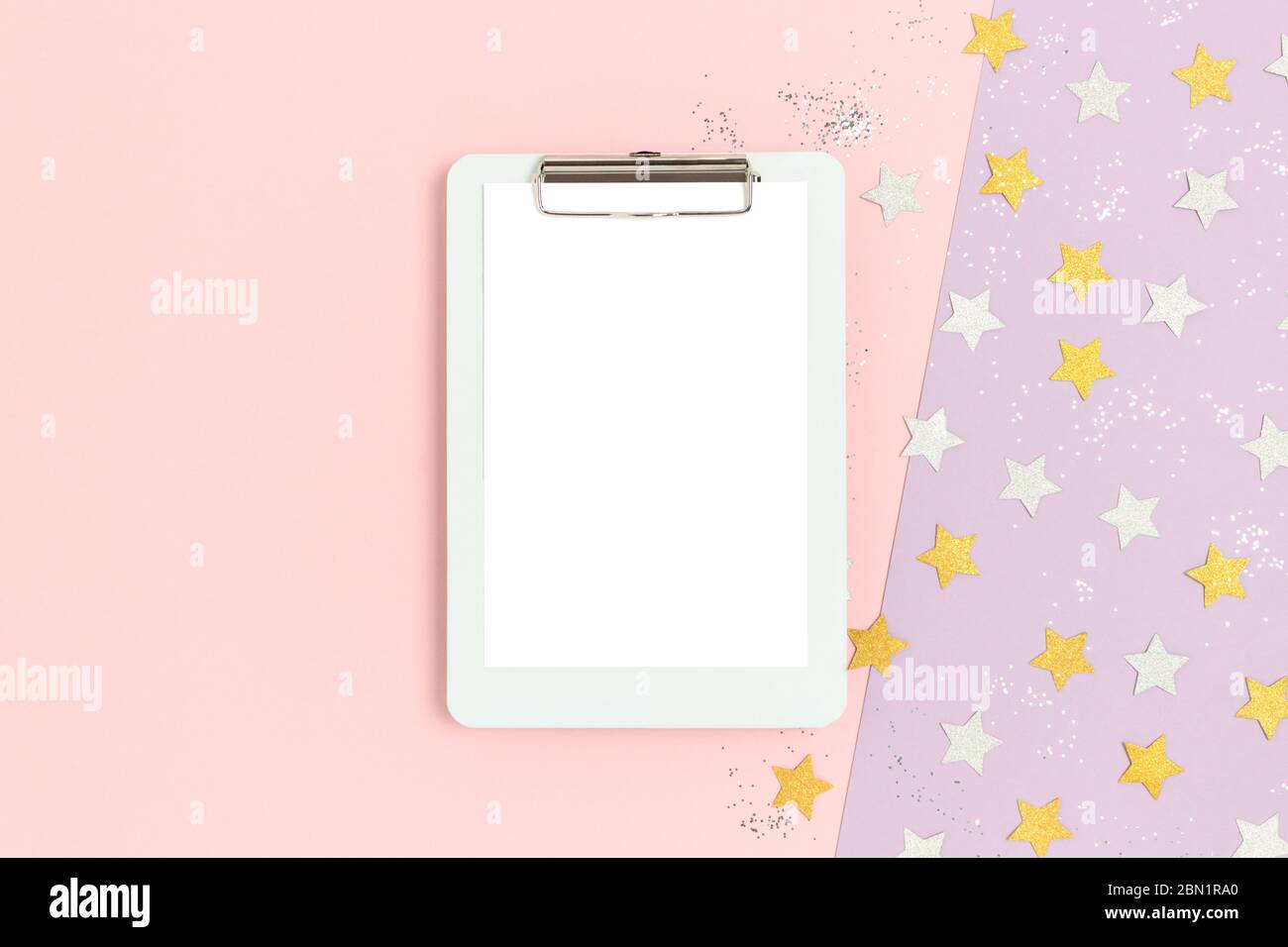 Clean clipboard mockup on a pink pastel background. Stars confetti ...