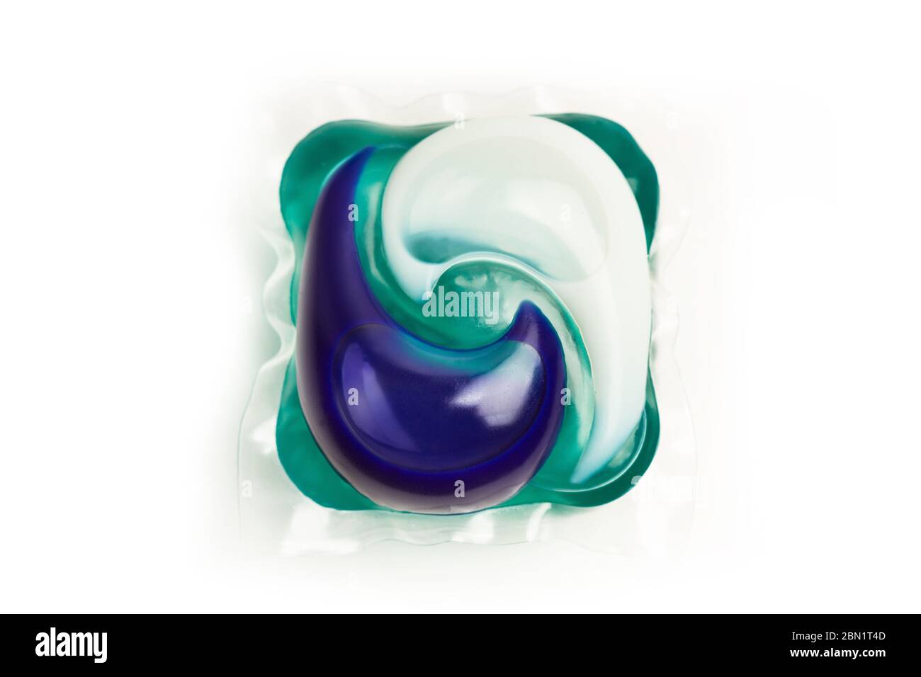 Washing machine detergent pod on a white background in a close up view ...