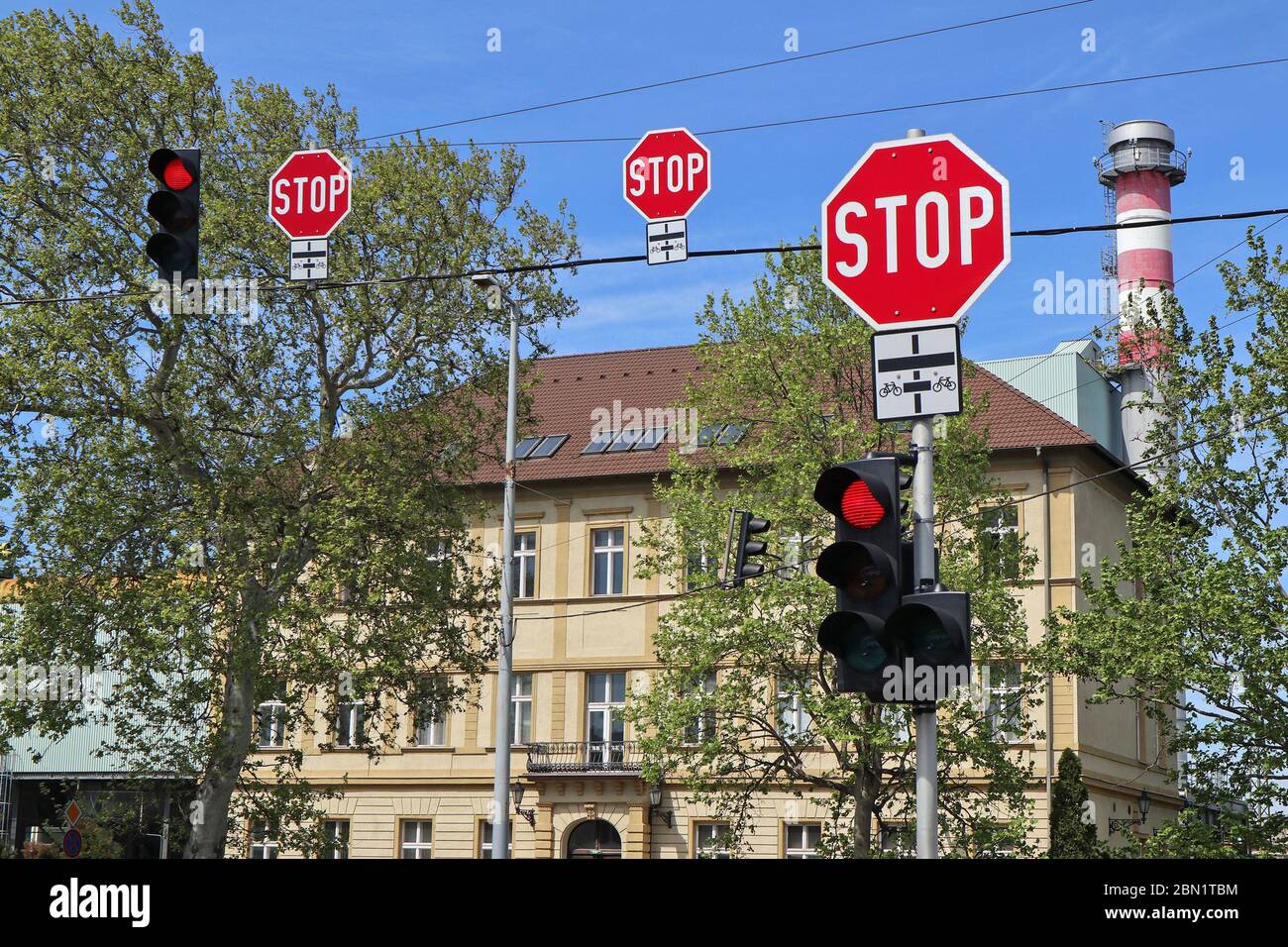 Stop signs and red traffic lights Stock Photo - Alamy