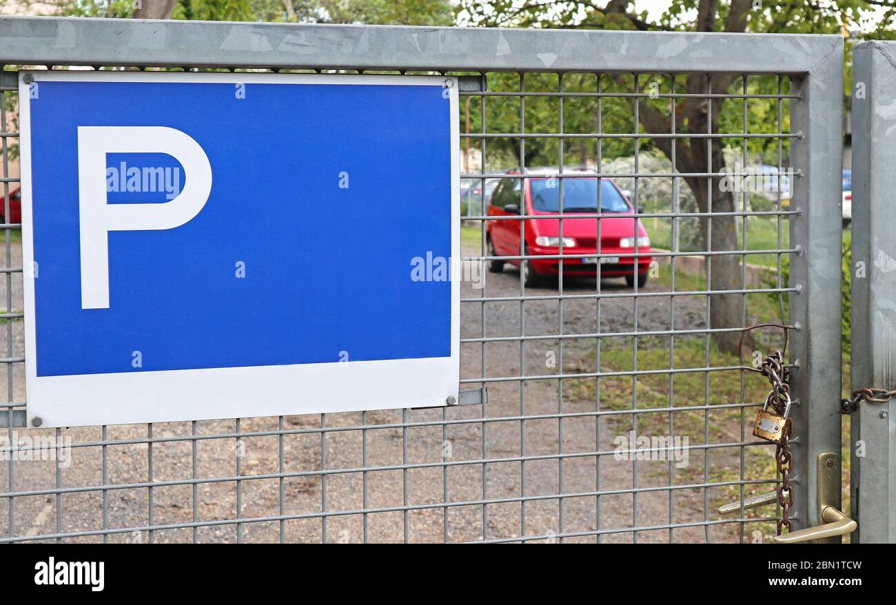 Closed parking lot and sign Stock Photo - Alamy