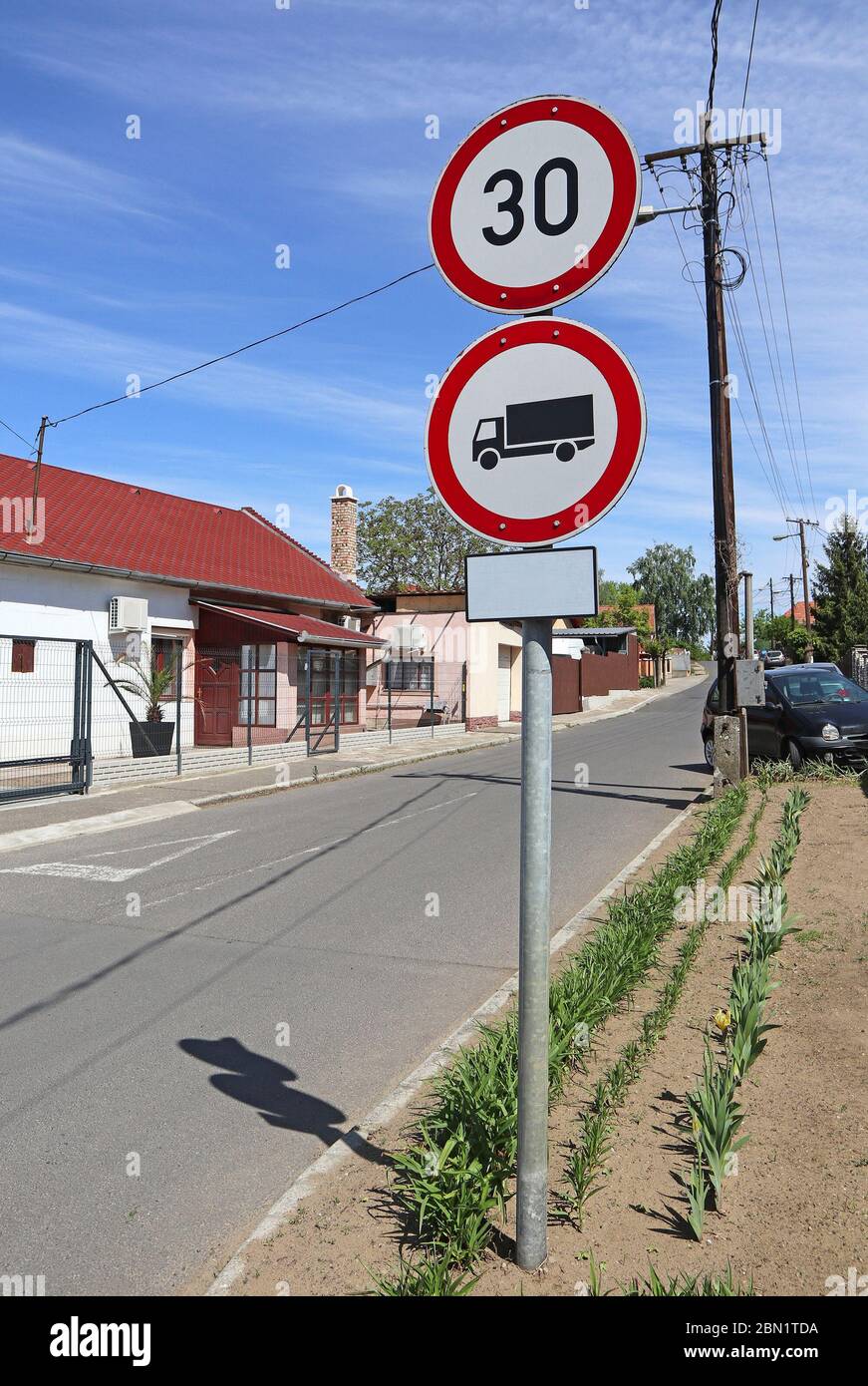Speed limit traffic sign on the street Stock Photo - Alamy