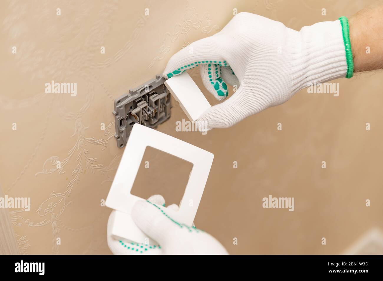 Electrician builder install working switches and sockets black color ...