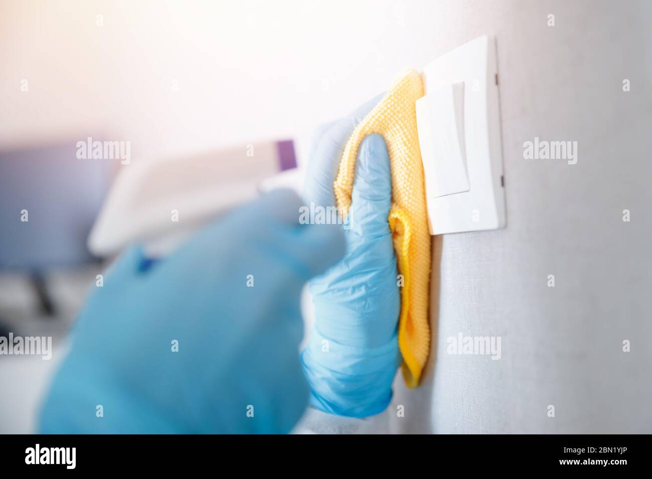 Close-up antiseptic cleaning switch and sockets disinfection of viruses ...