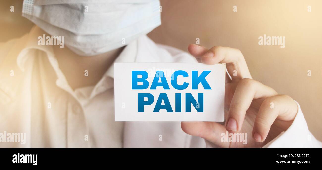 Back Pain card in hands of Medical Doctor. Chronic Pain relief ...
