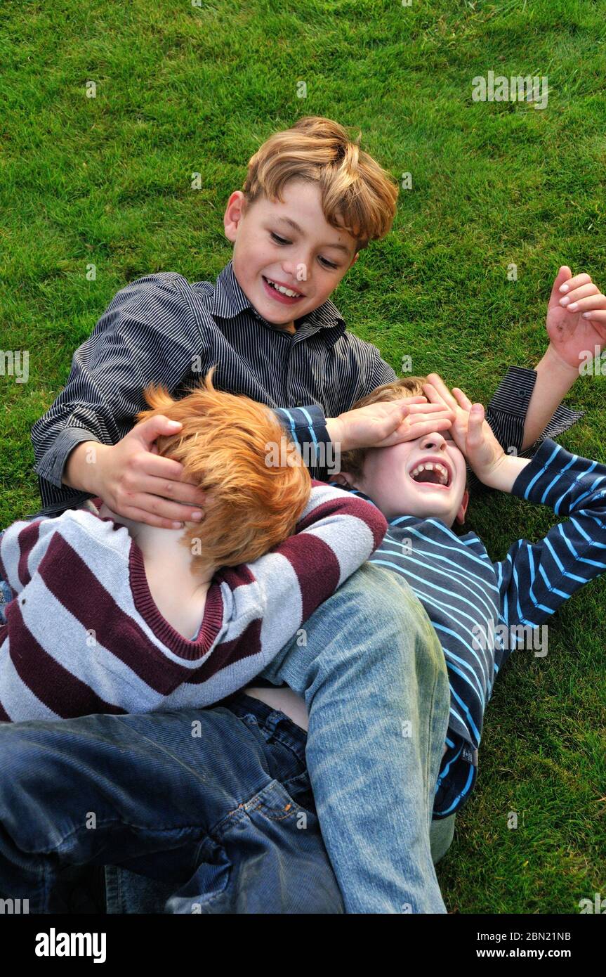 10 yr old boy playing with cousins in a park. Berkshire Stock Photo - Alamy