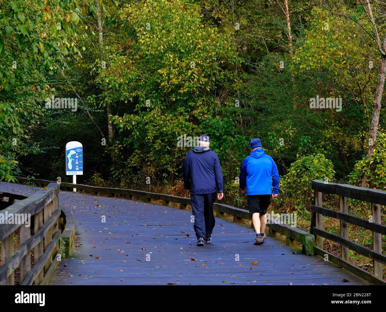 Two guys walking hi-res stock photography and images - Alamy