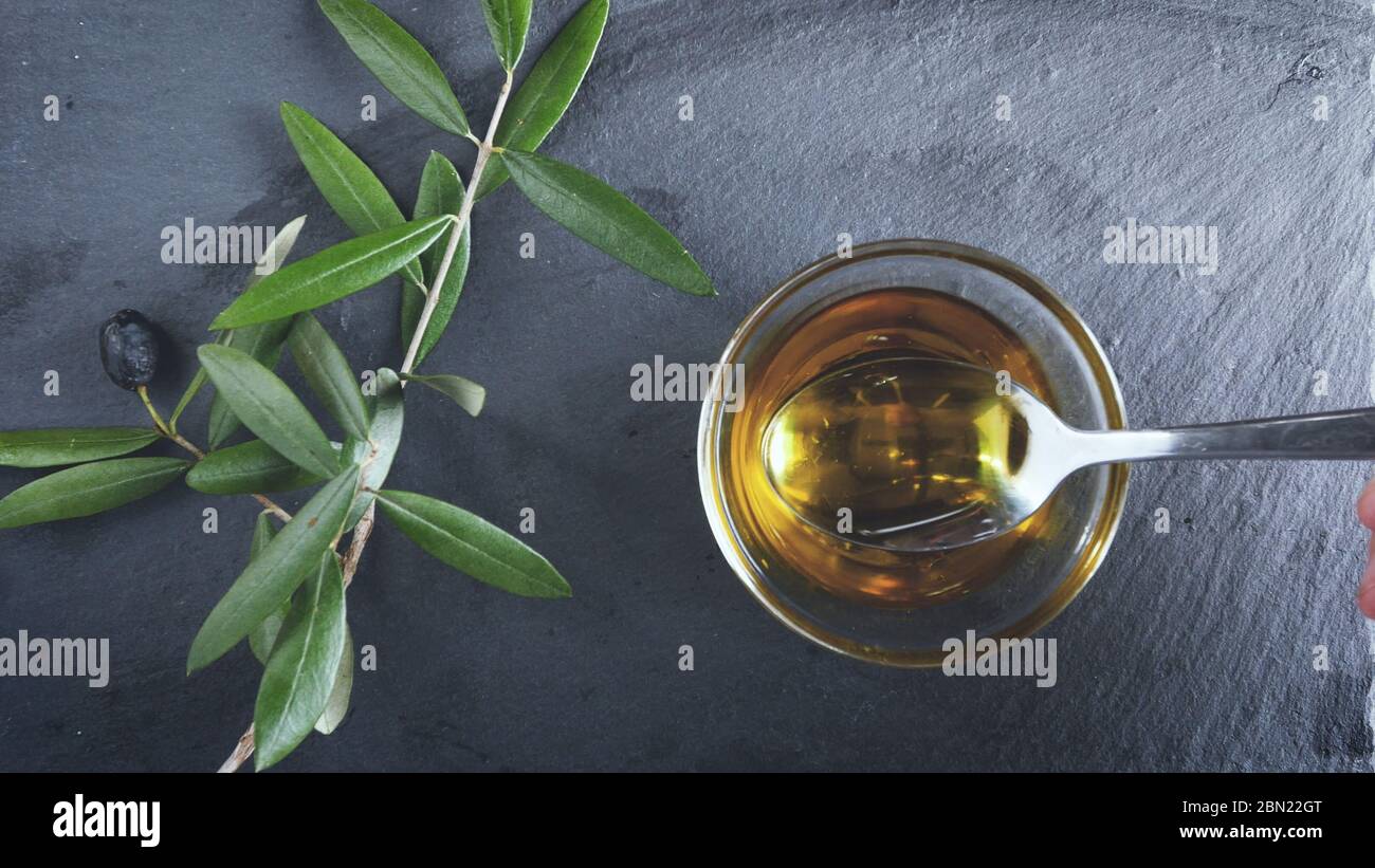 Extra Virgin oil. A tablespoon hold on the olive oil. Healthy food ...